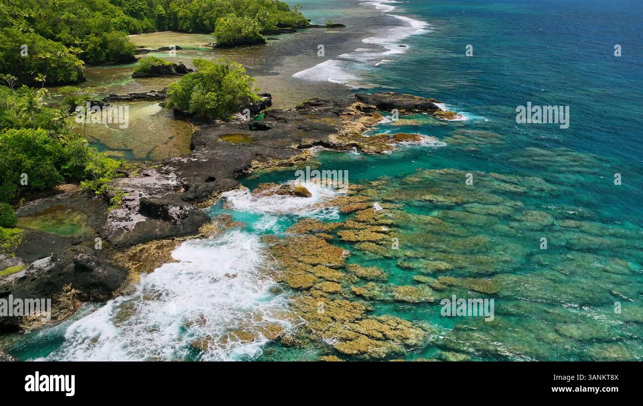 Aerial view of beautiful tropical island with vibrant coral reef and ...