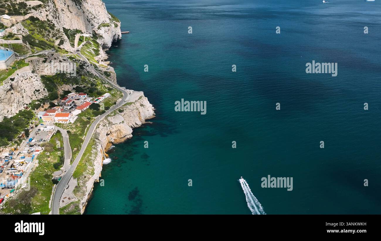 Aerial view of a beautiful coastal landscape with a small boat near ...