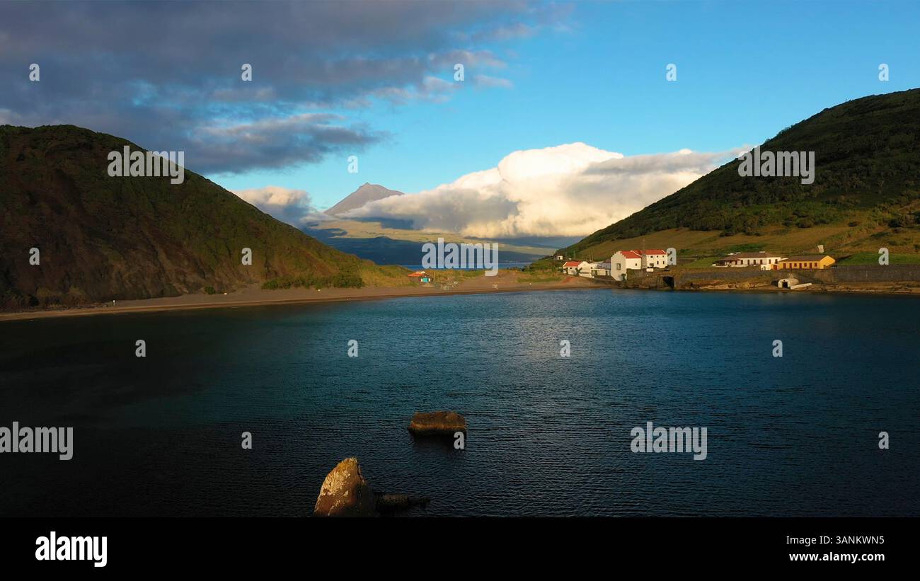 Aerial view of a beautiful coastal village surrounded by serene waters ...