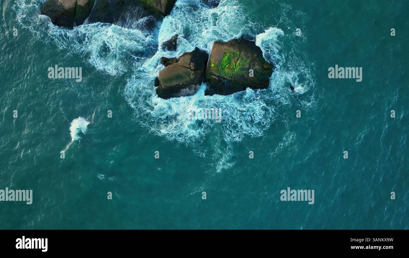 Aerial view of beautiful rocky coastline with tranquil waves and azure ...