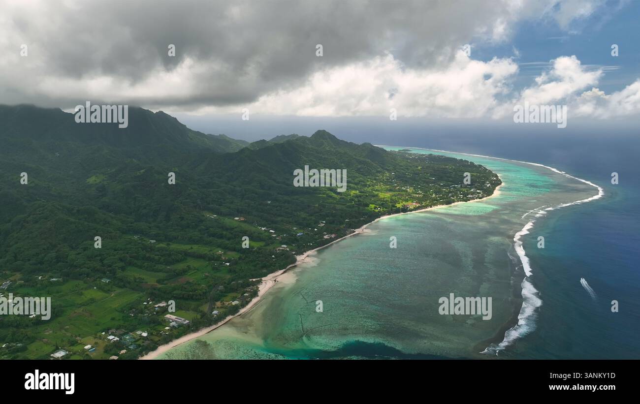 Aerial view of the idyllic tropical lagoon and pristine beach with lush ...