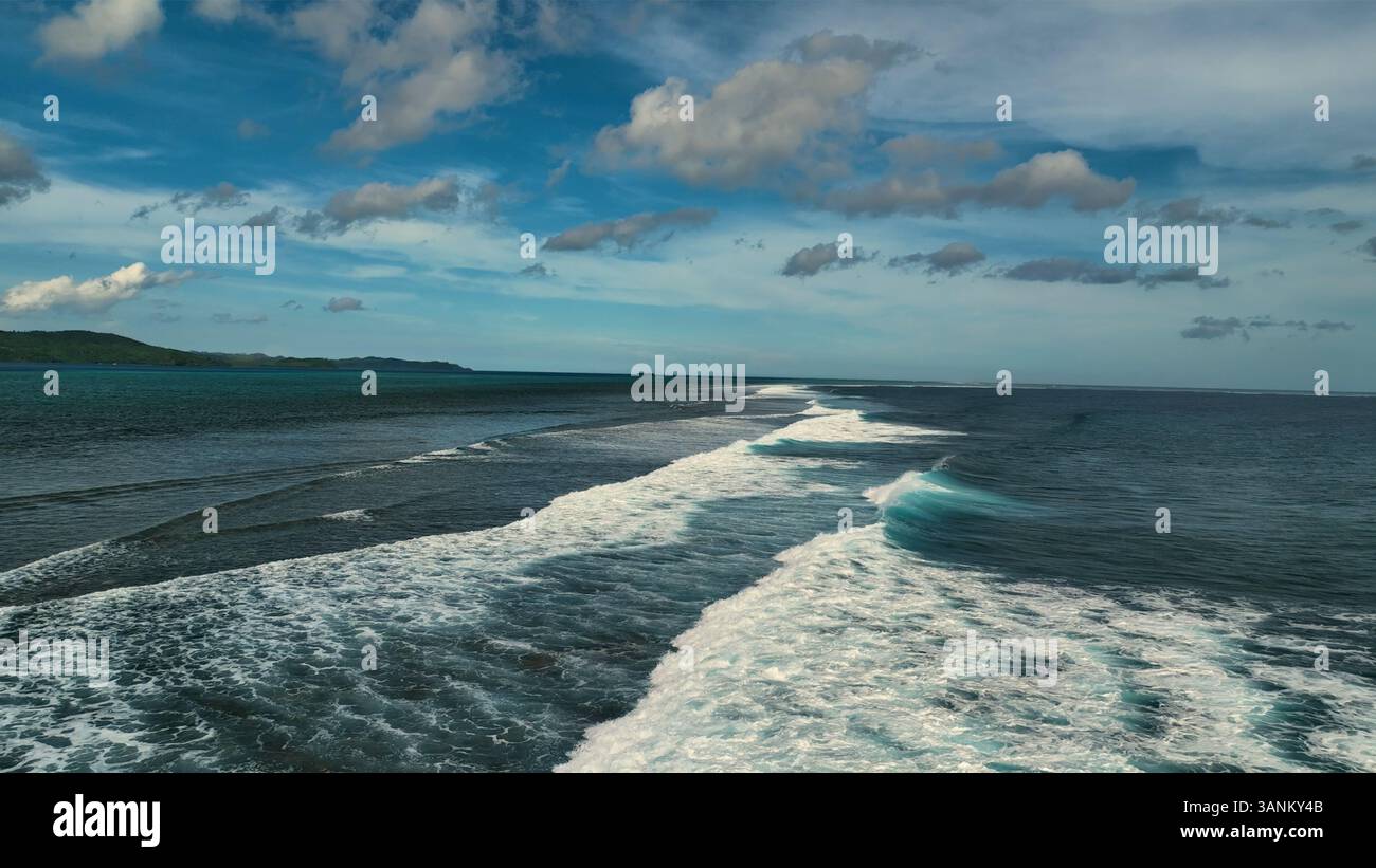 Aerial view of tropical paradise island with azure ocean waves and reef ...