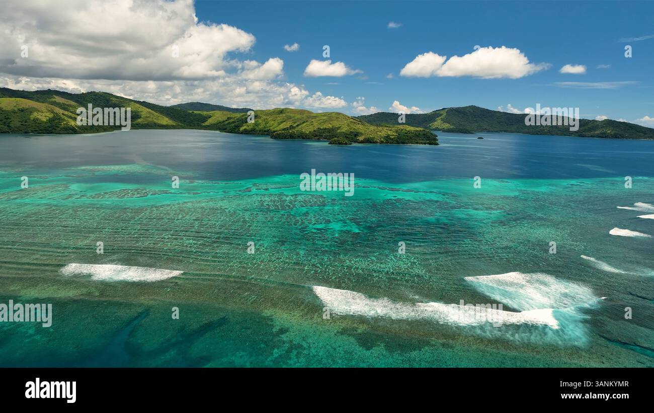 Aerial view of tropical island with reef and clouds, Fiji Stock Photo ...
