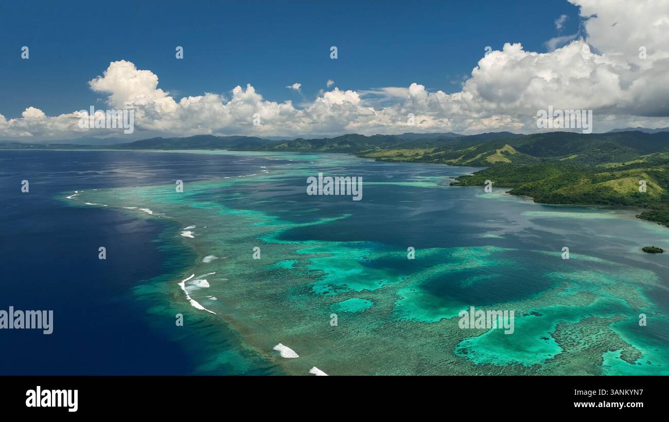 Aerial view of tropical island with reef and clouds, Fiji Stock Photo ...