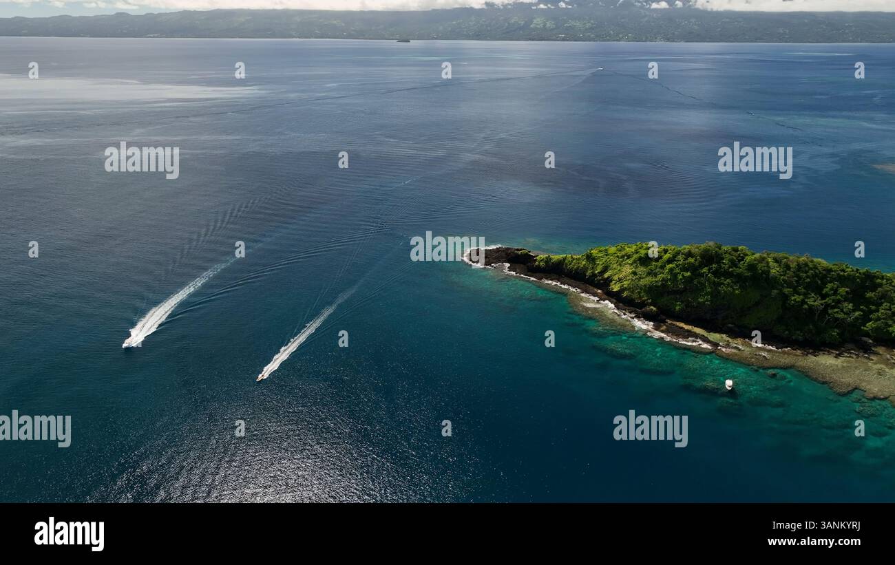 Aerial view of serene tropical island with azure waters and lush ...