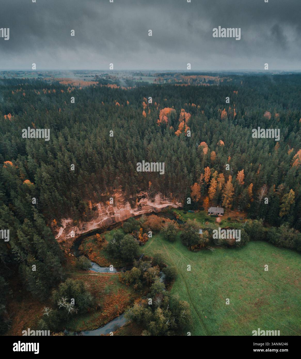 Aerial view of Harma sandstone walls and colourful trees in Piusa river ...