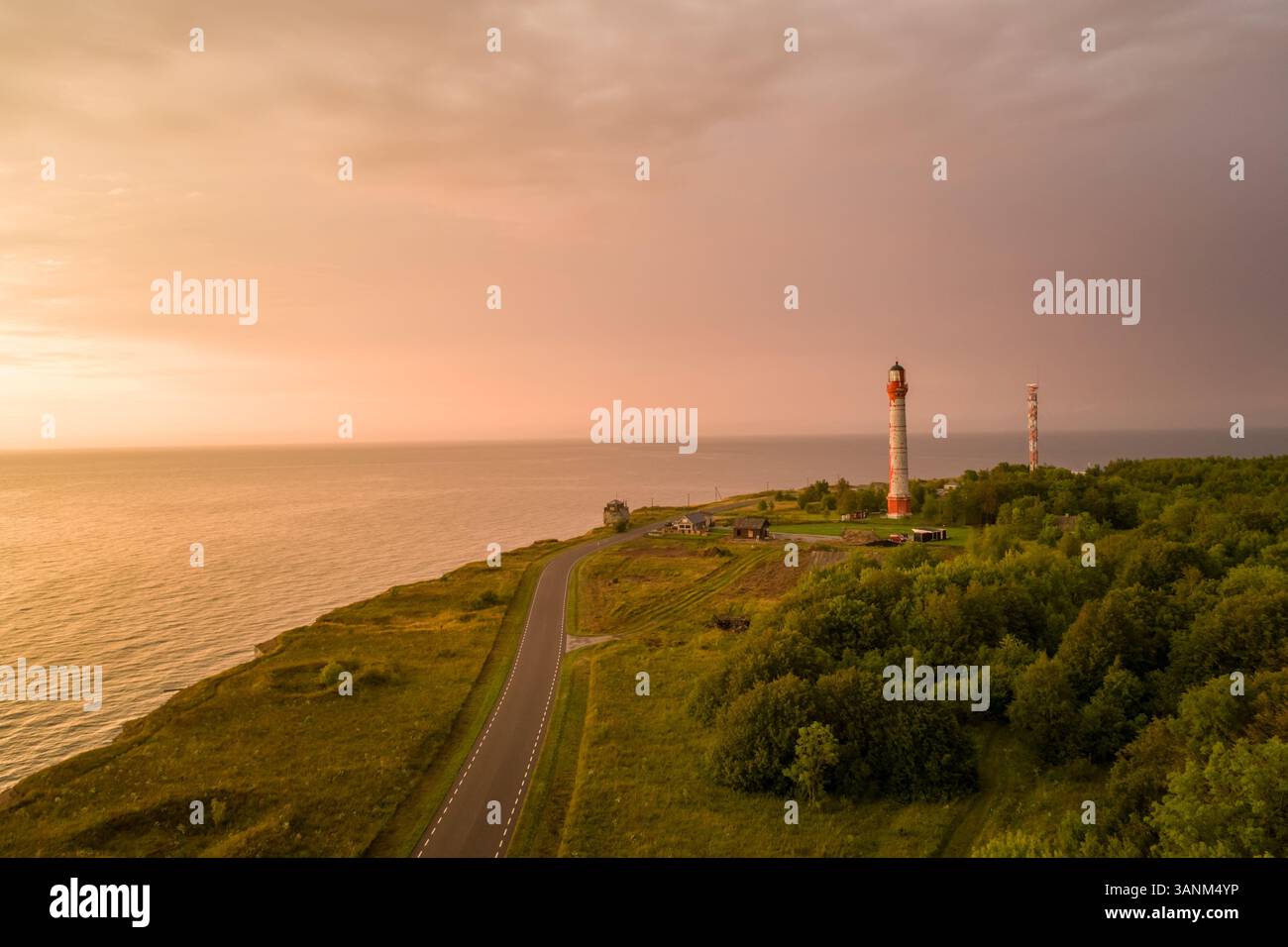 Aerial view of Pakri lighthouse on Pakri peninsula at sunset in Estonia ...
