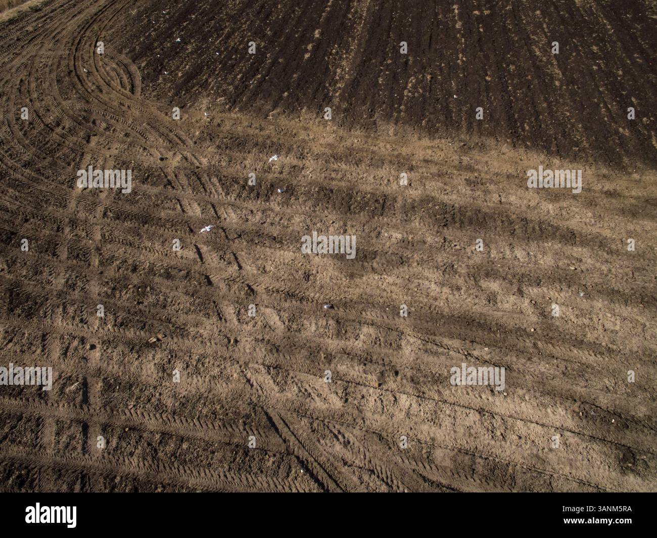 Aerial view of tractor tracks on soil of farmland in Estonia Stock ...