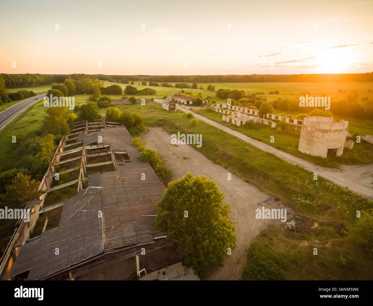 Aerial view of industrial ruins in countryside of Estonia at sunset ...