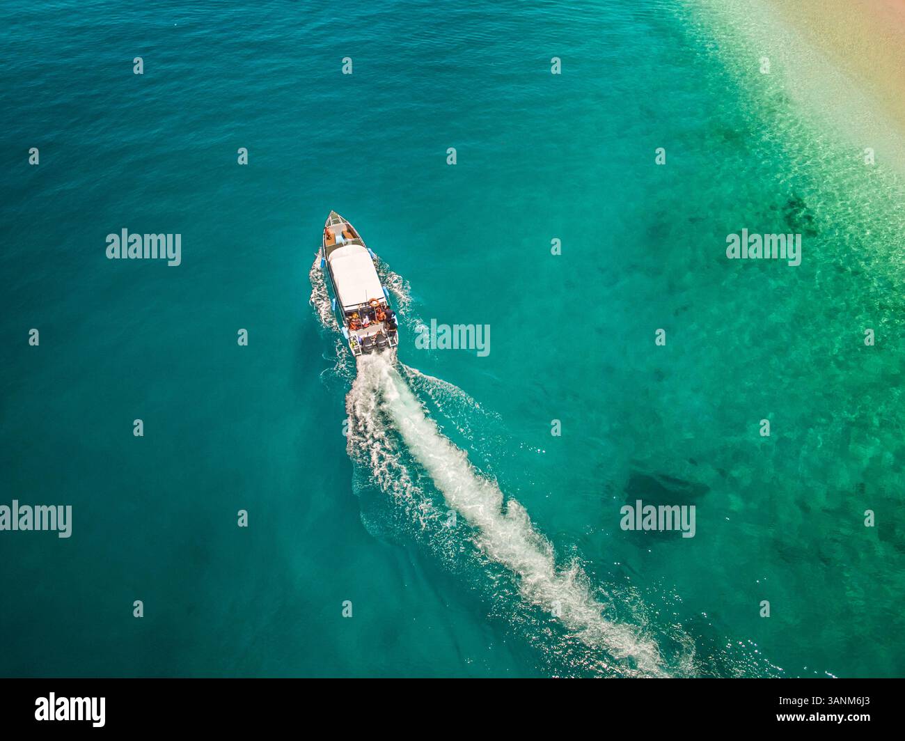 Aerial view of a traditional boat in the paradisiacal sea of Koh Rok ...