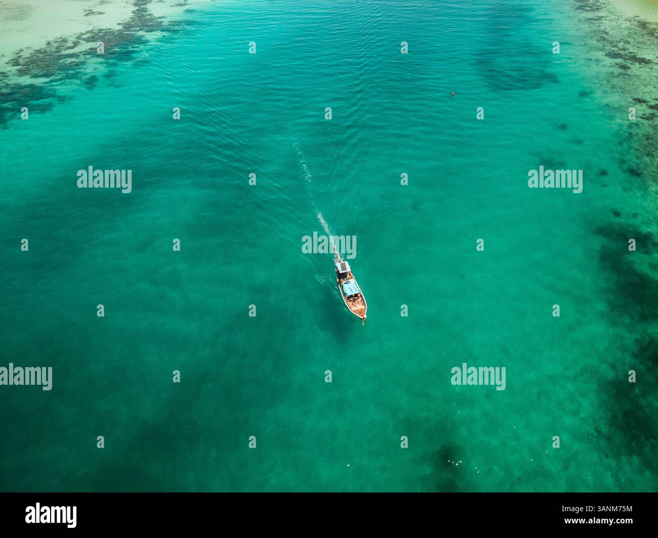 Aerial view of a traditional boat in the paradisiacal sea of Koh Rok ...
