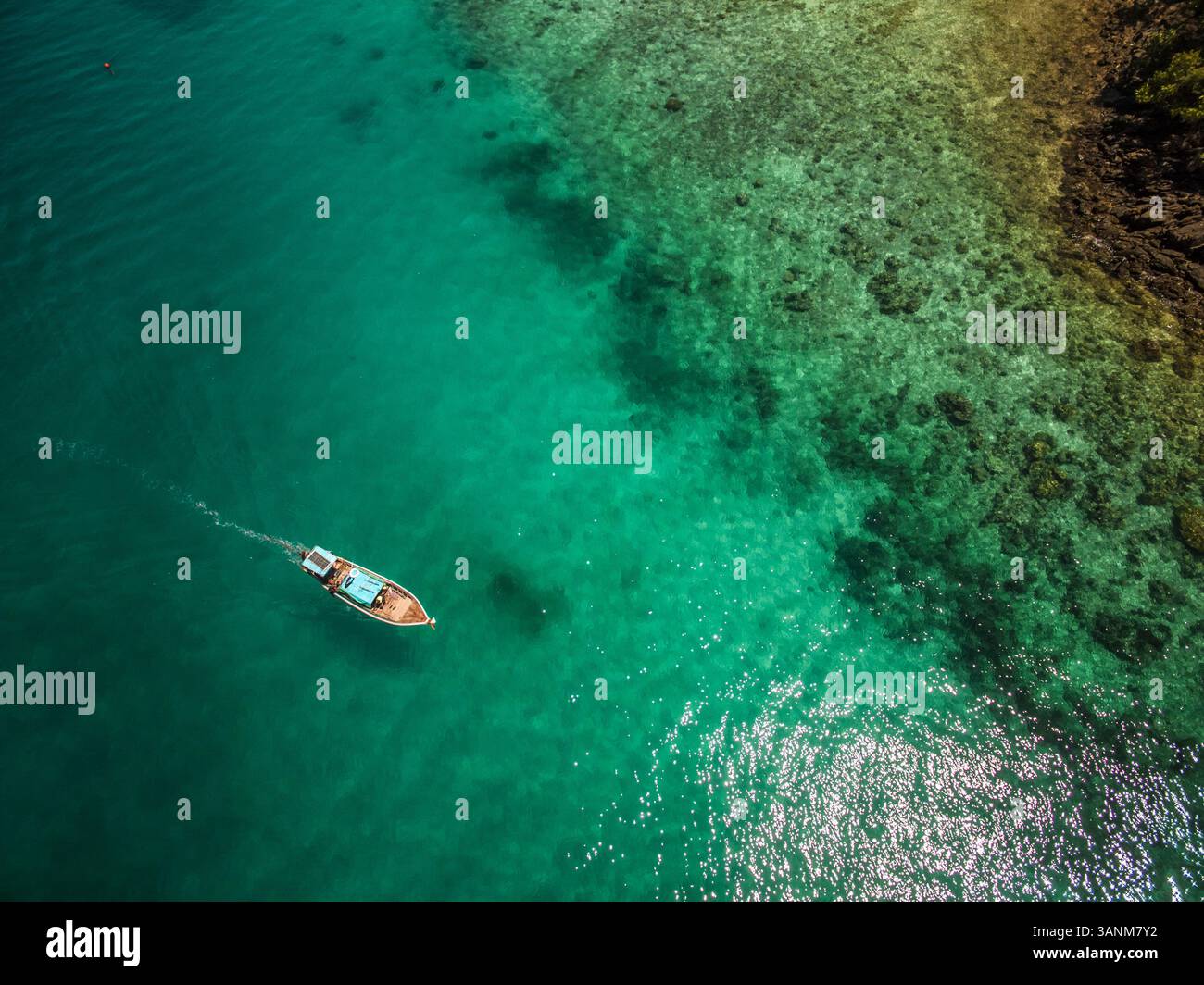 Aerial view of a traditional boat in the paradisiacal sea of Koh Rok ...