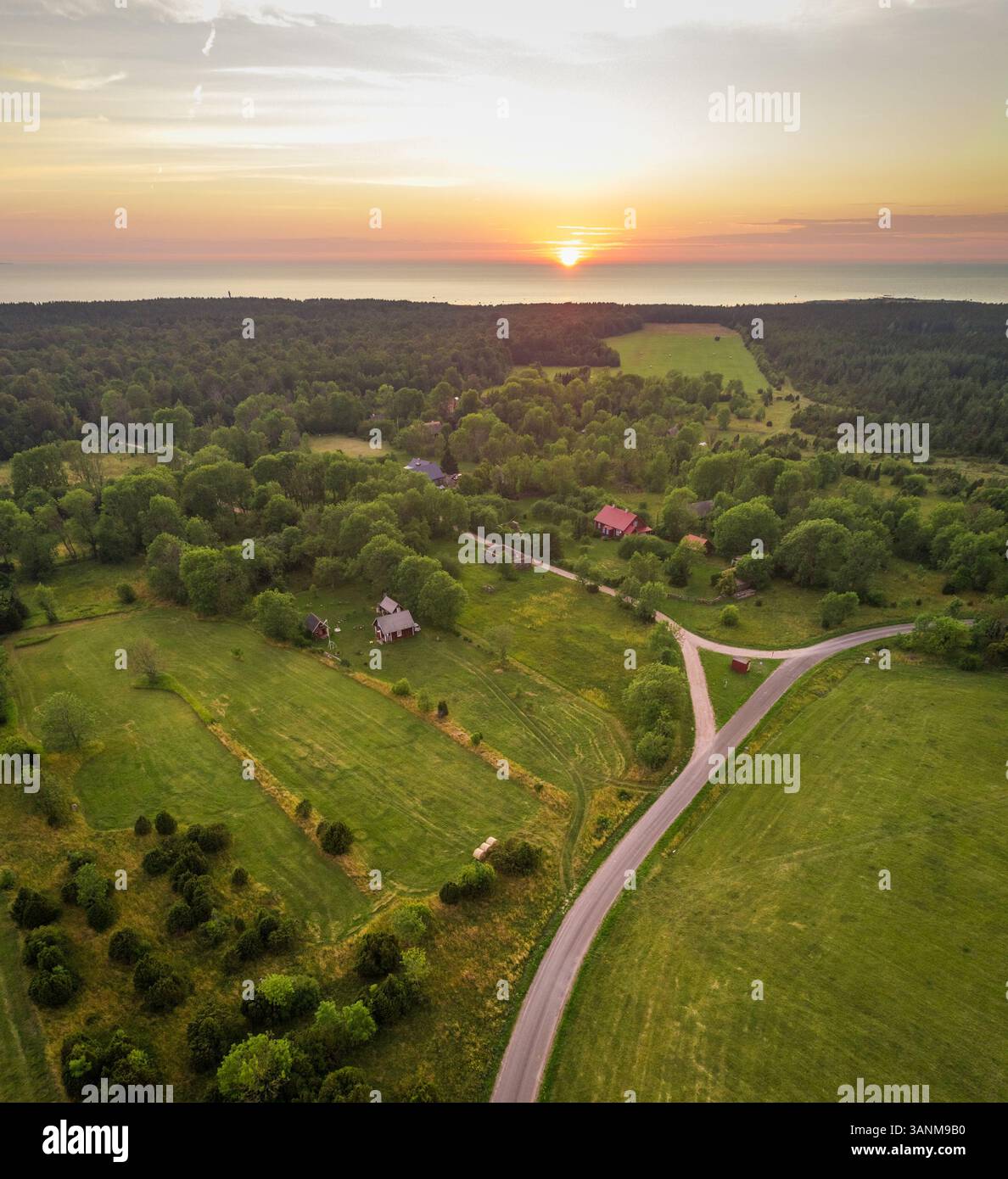 Aerial view of road going through village and fields on Forby on Vormsi ...