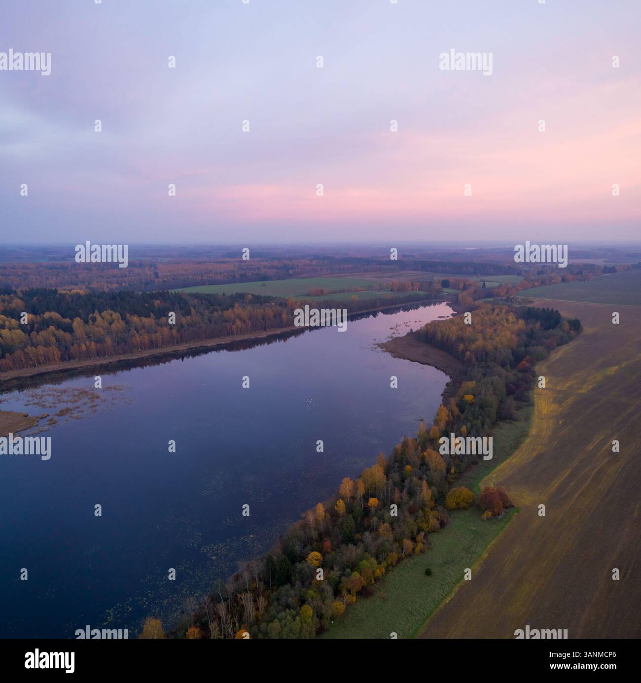 Aerial view of lake near the city during the nightfall, Estonia Stock ...