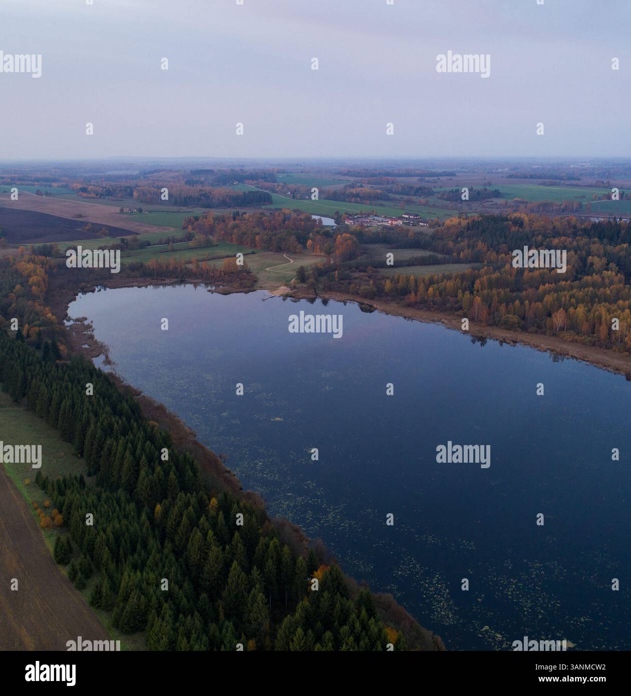 Aerial view of lake near the city during the nightfall, Estonia Stock ...
