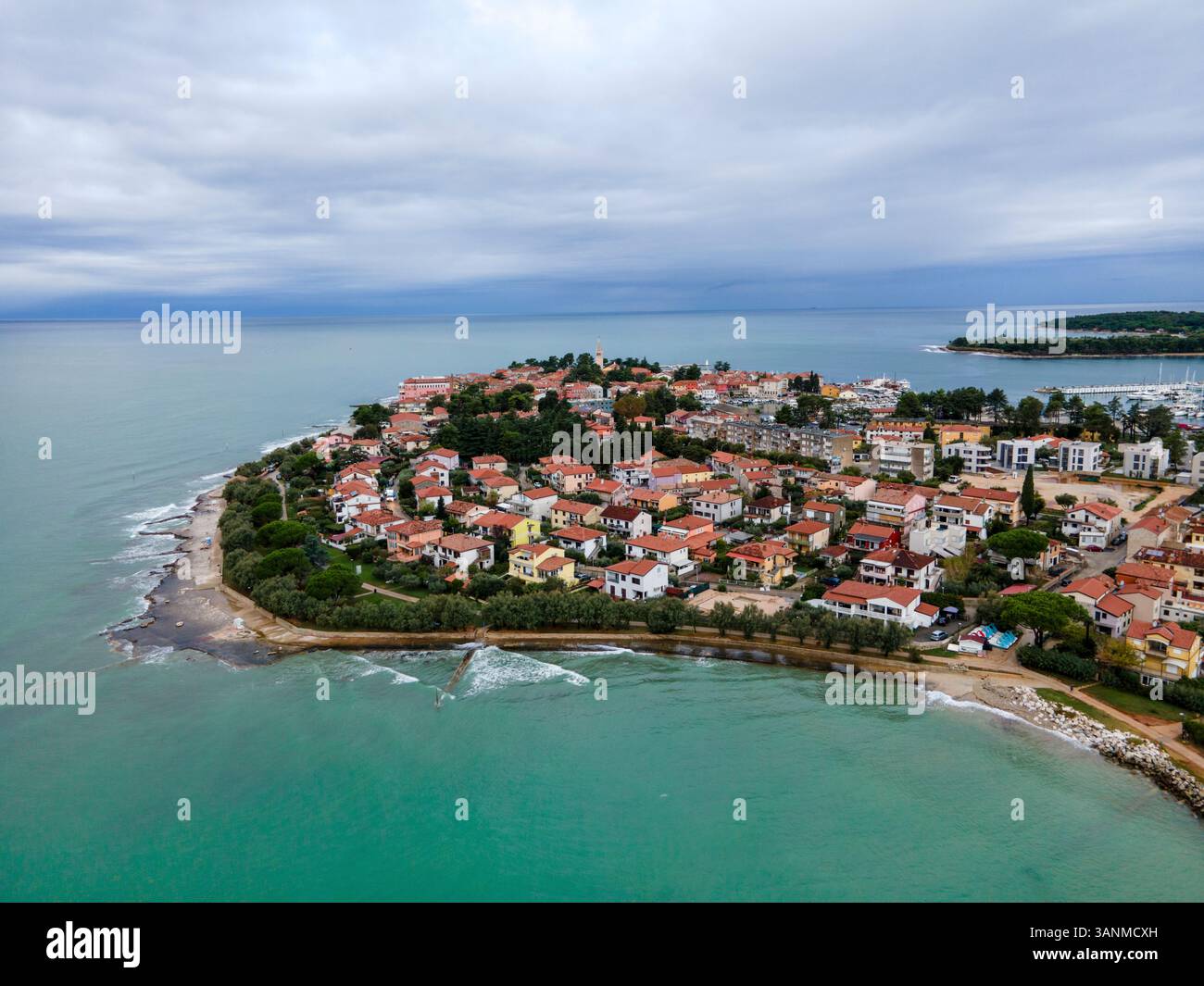 Aerial view of beautiful coastal town with residential buildings and ...