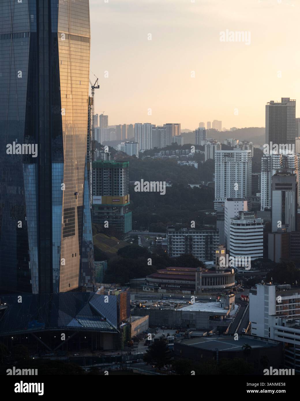 Aerial view of Merdeka 118 skyscraper amidst a beautiful sunset skyline ...