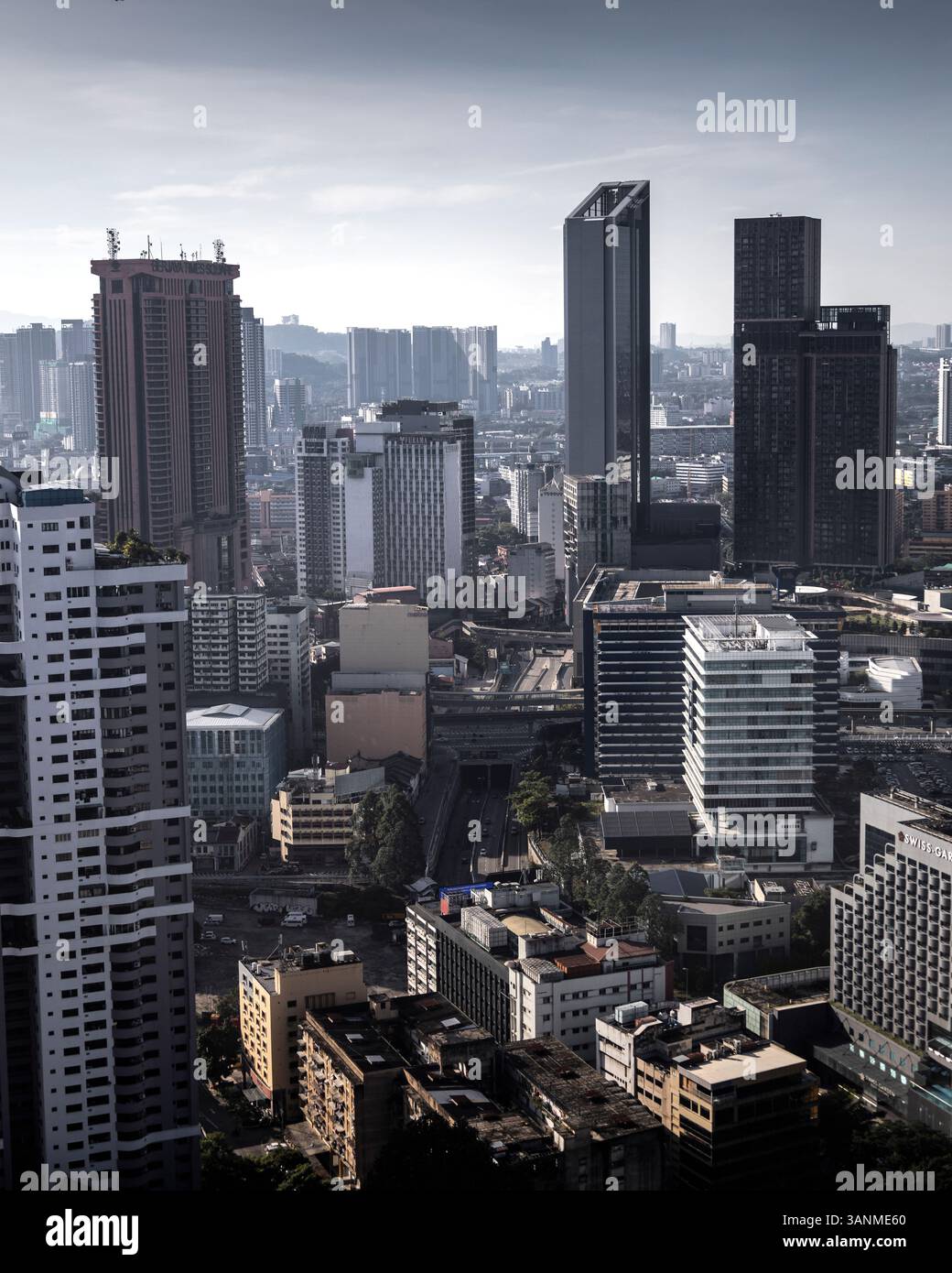 Aerial view of bustling cityscape with modern skyscrapers and dense ...