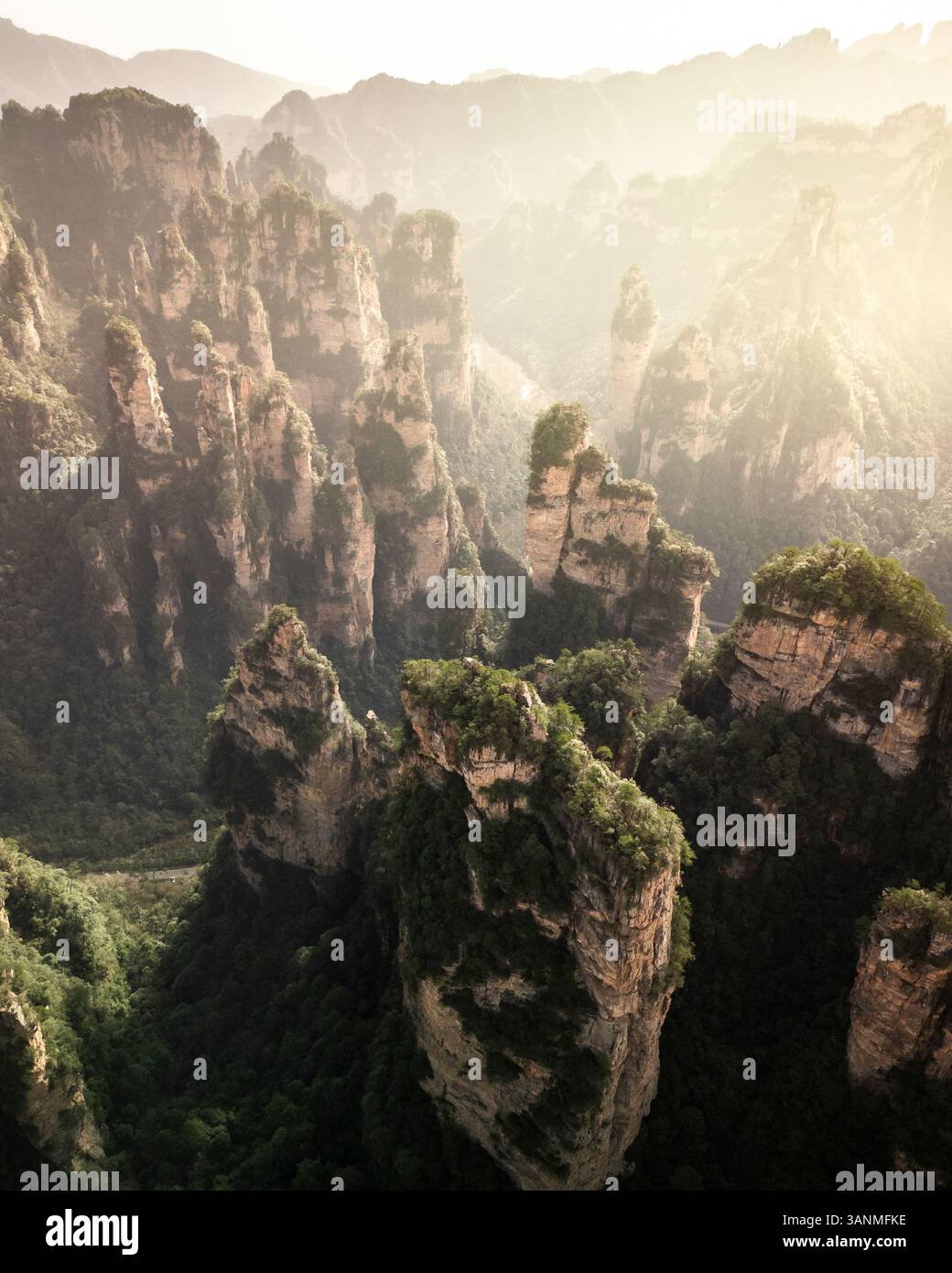 Aerial view of majestic rock formations and vertical cliffs surrounded ...