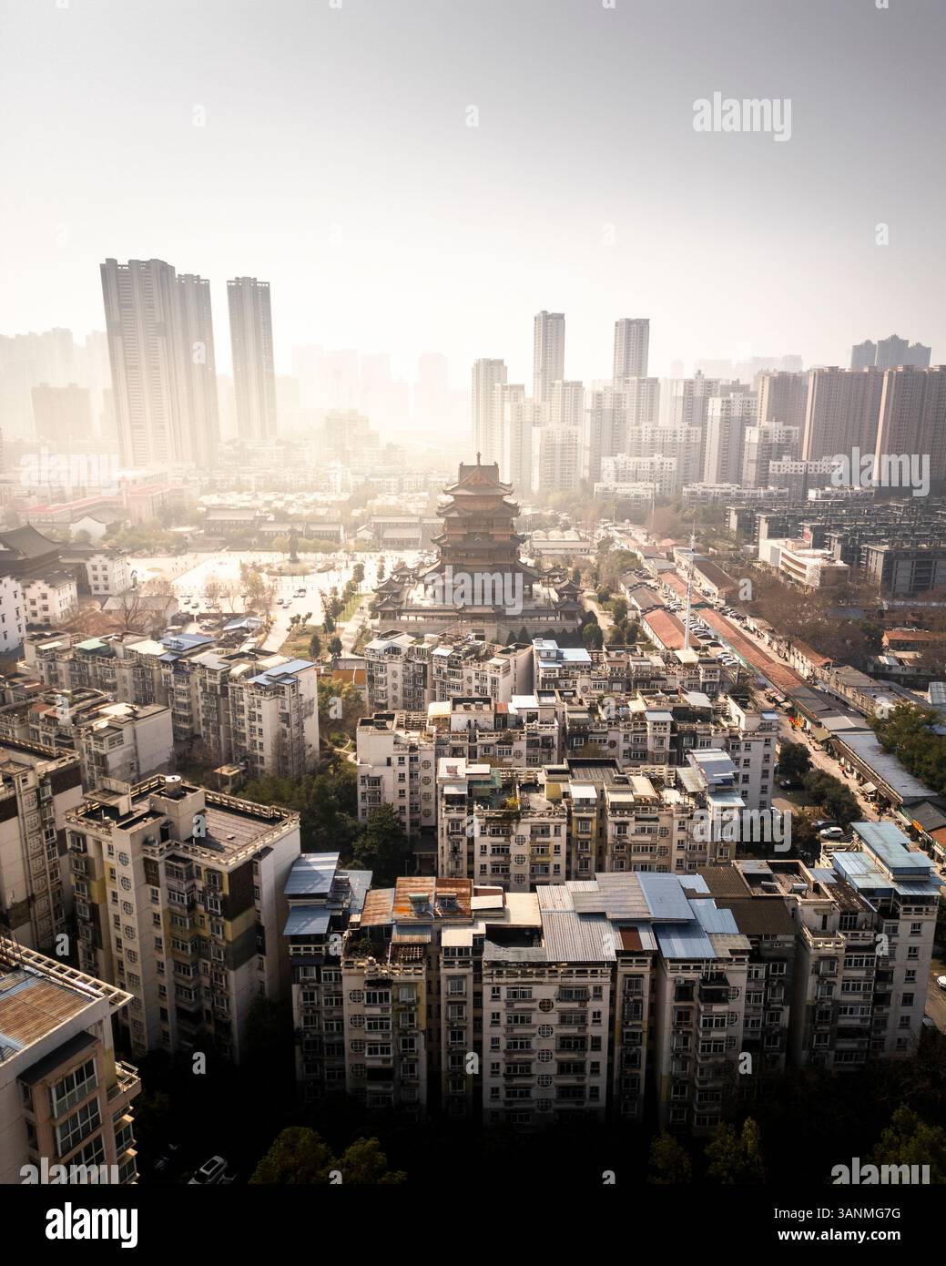 Aerial view of gui yuan temple surrounded by skyscrapers and a bustling ...