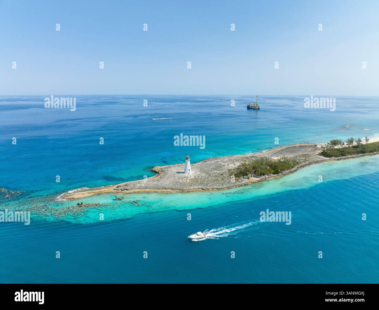 Aerial view of turquoise waters surrounding Nassau Harbour Lighthouse ...