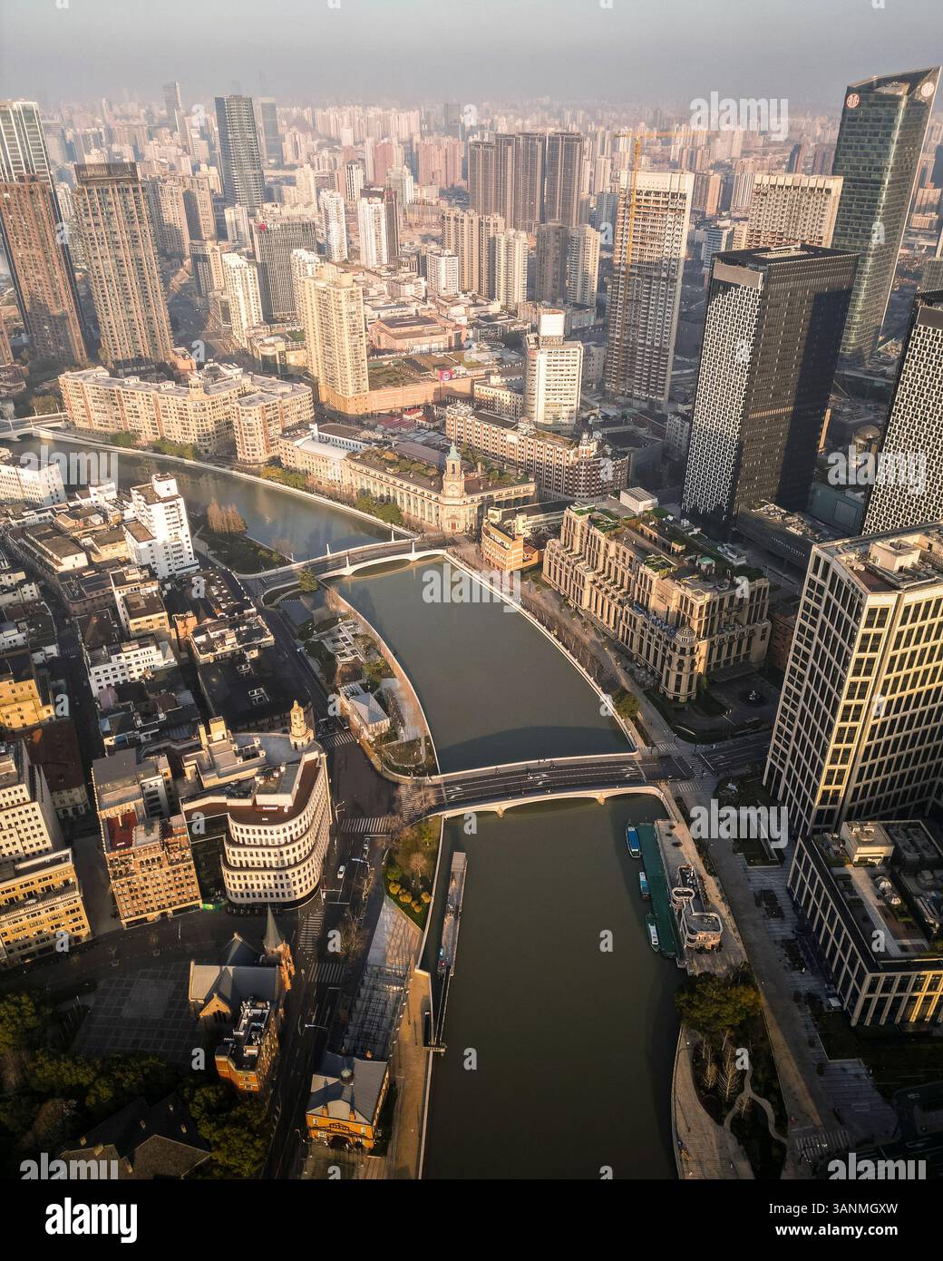 Aerial view of beautiful cityscape with modern skyscrapers and a river ...