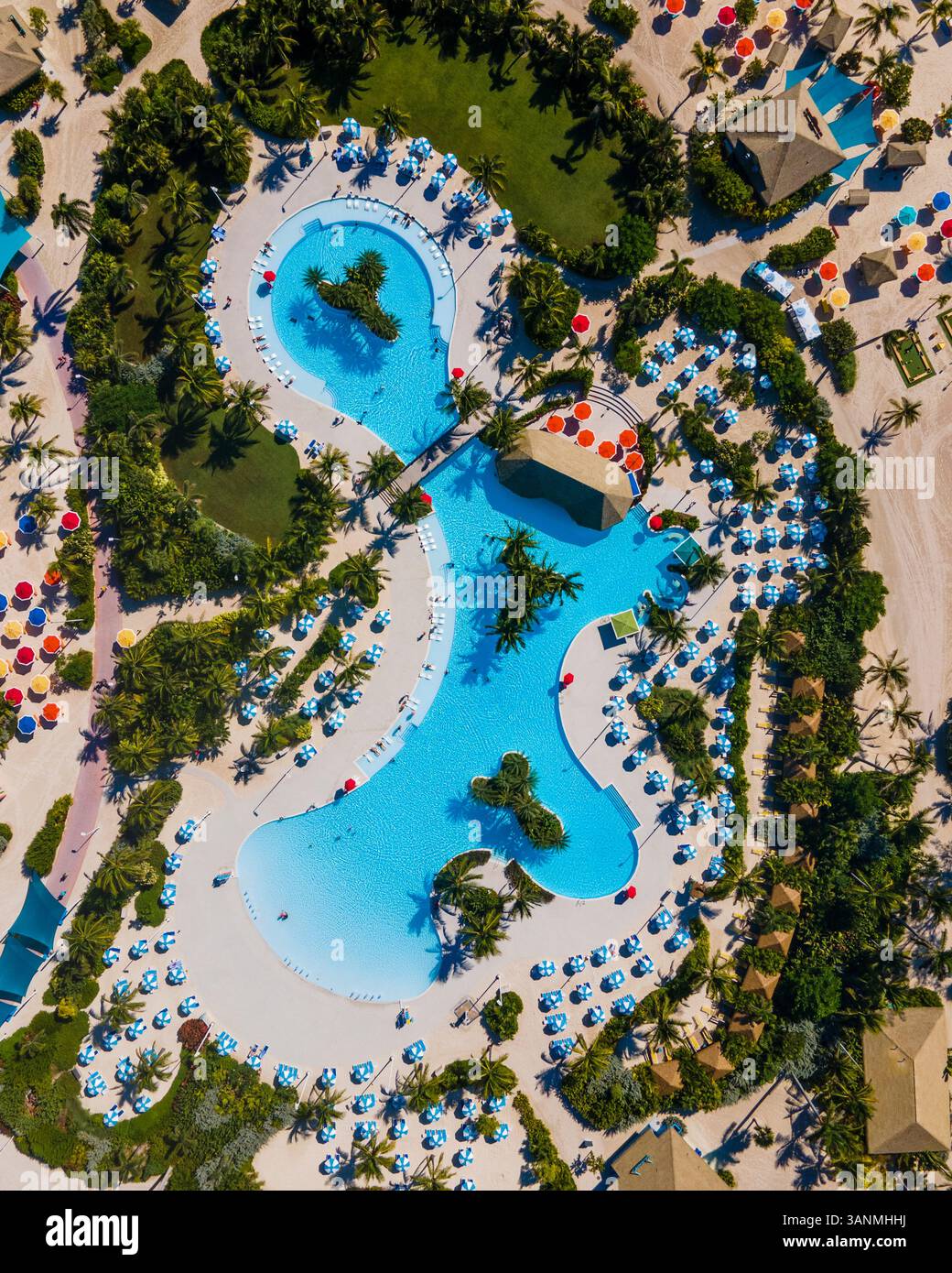 Aerial view of luxury hotel with swimming pool by the blue water, Coco ...