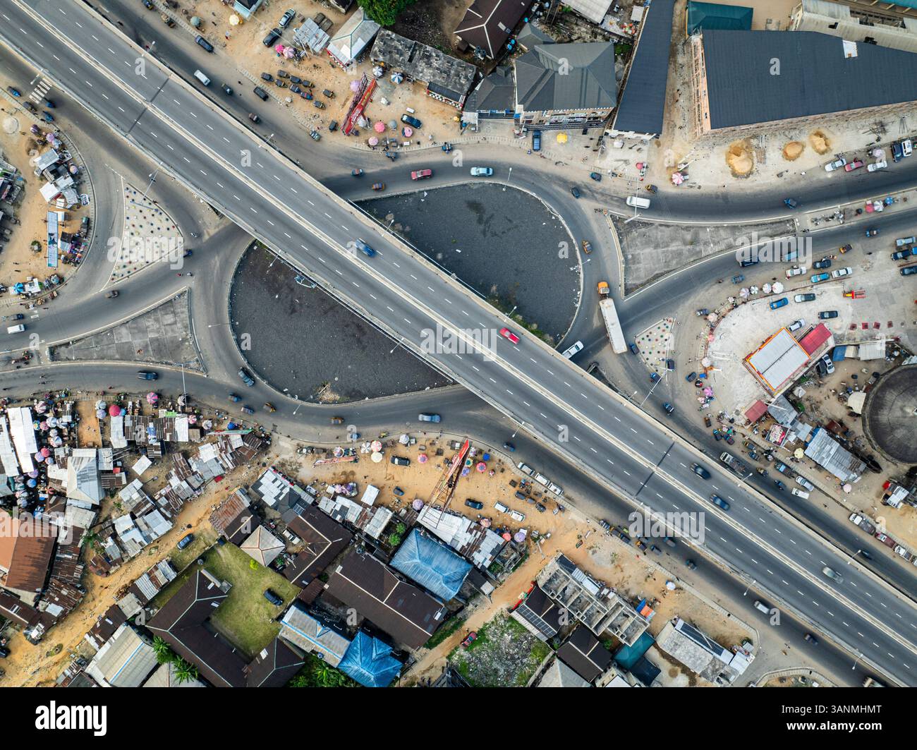 Aerial view of busy tank junction with intersecting highways and urban ...