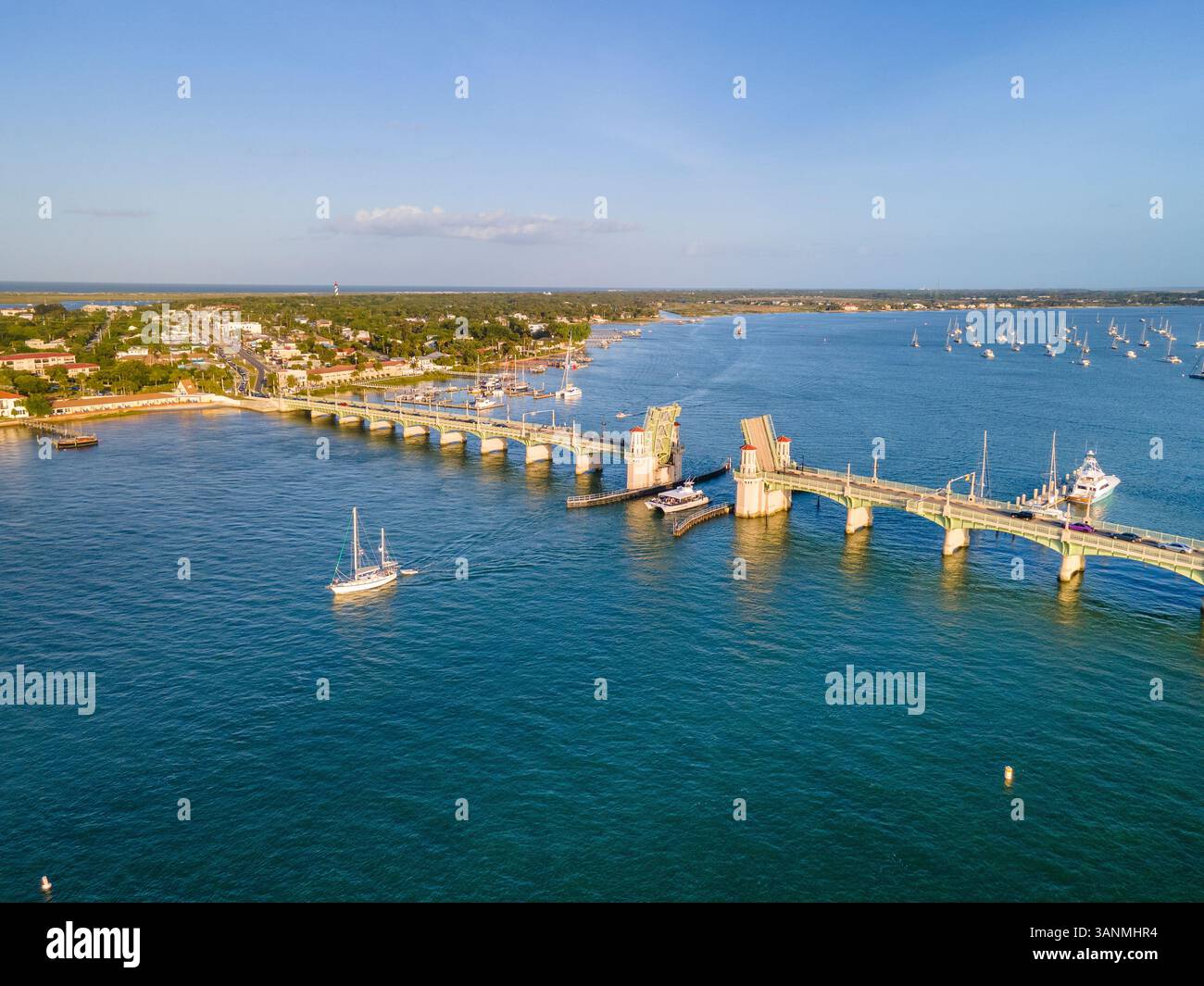 Aerial View of the Bridge of Lions with a lighthouse in the background ...