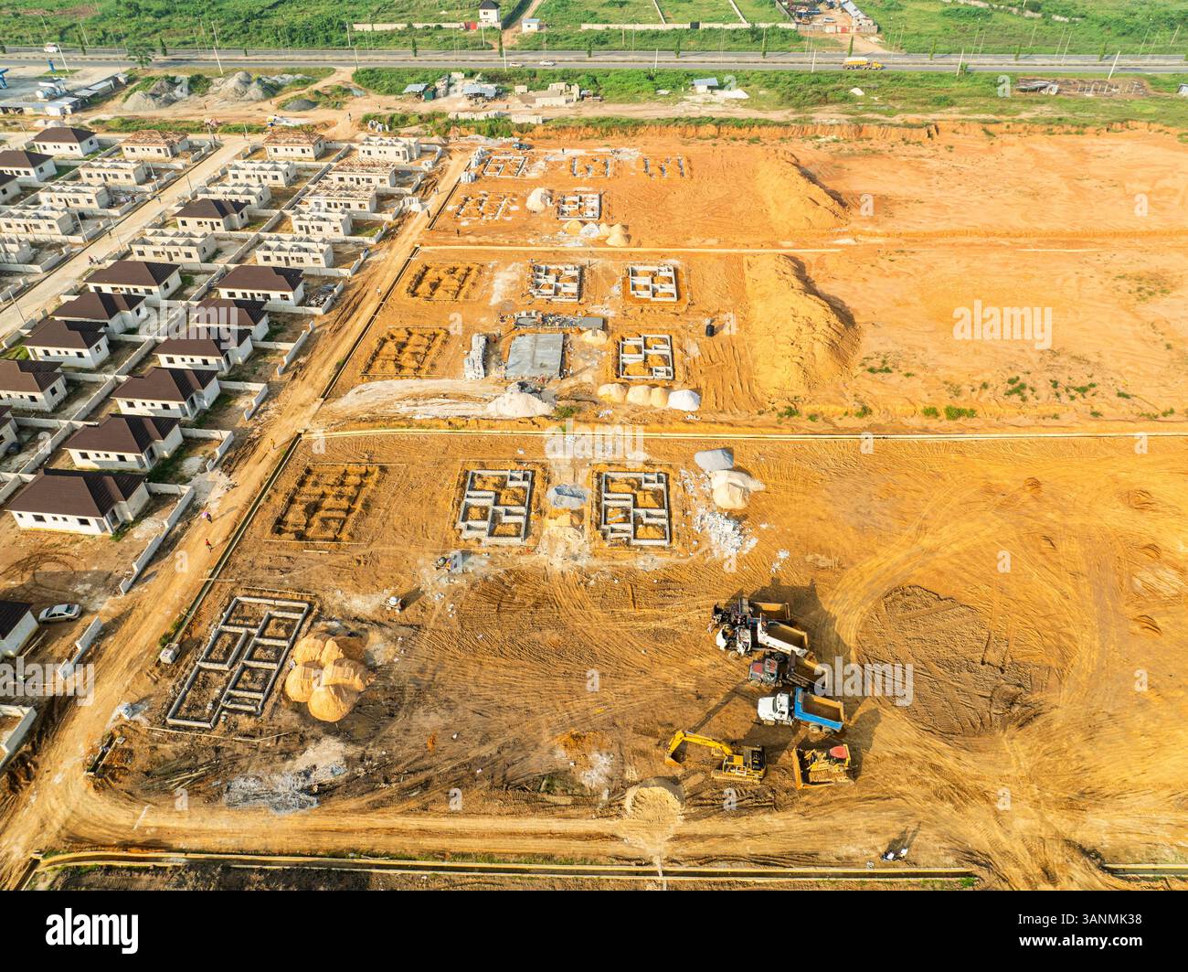 Aerial view of construction site with excavators and uncompleted ...