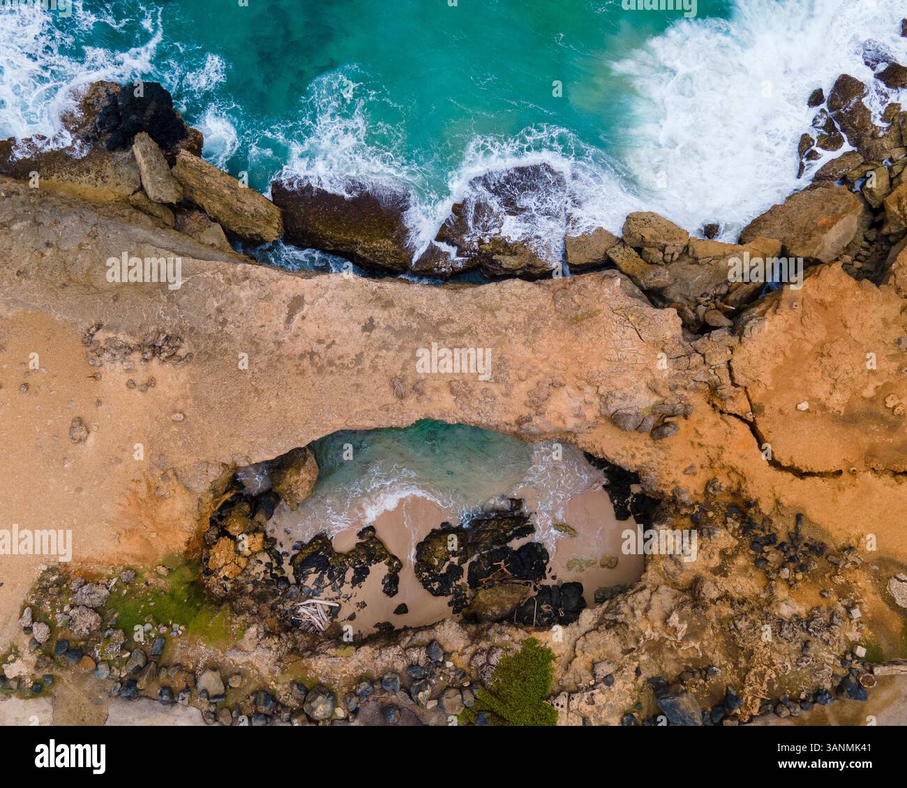 Aerial view of the Natural Bridge along the coastline with cliffs in ...