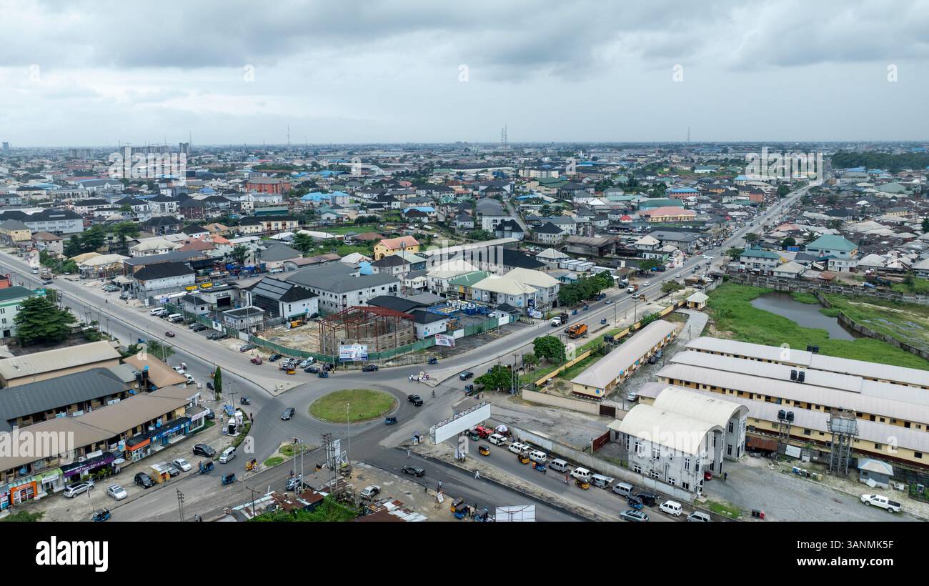 Aerial view of JDP Roundabout and urban landscape with busy roads and residential buildings ...