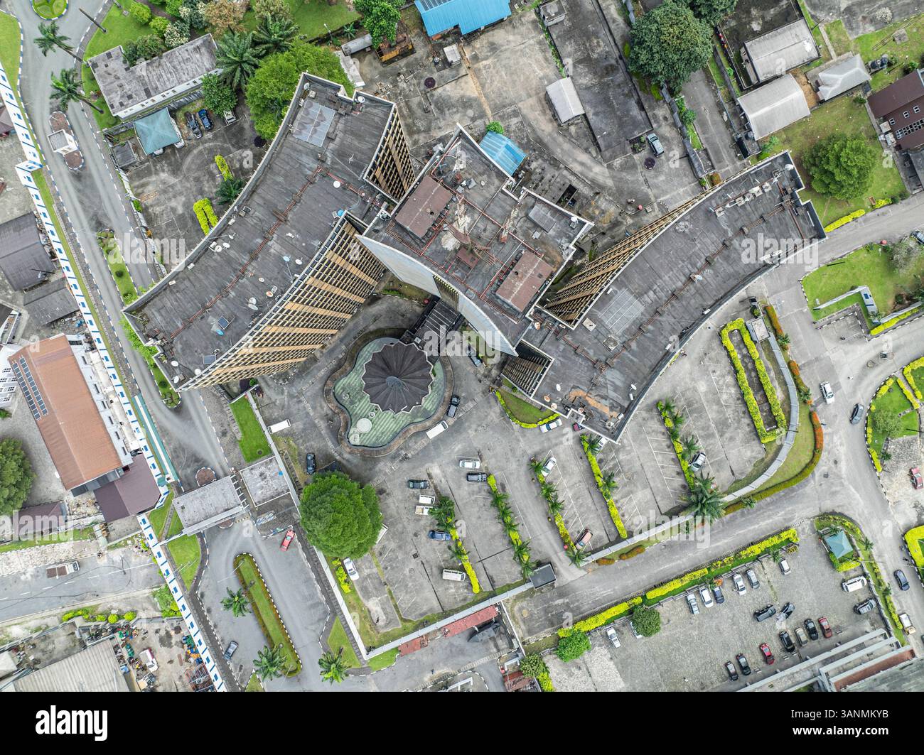 Aerial view of modern podium block architecture with parking lot and ...