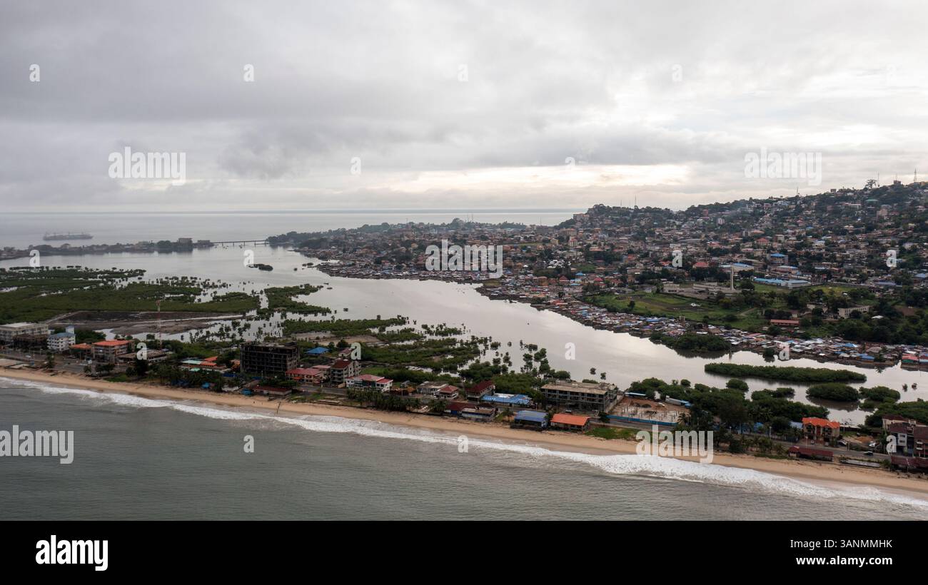 Aerial view of water between houses in a coastal town surrounded by ...