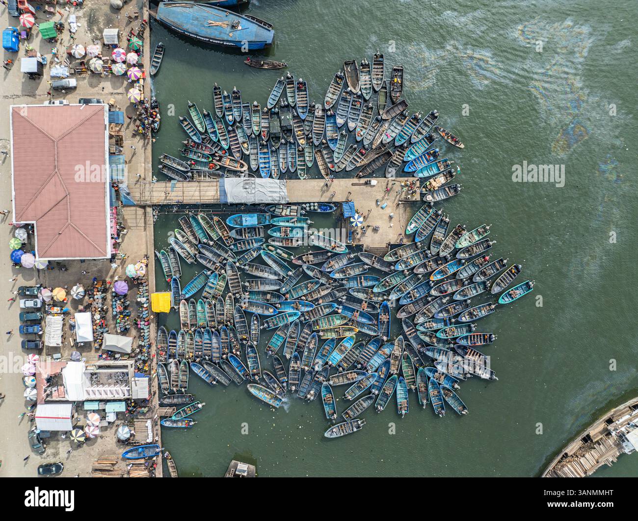 Aerial view of bonny jetty bustling with traditional boats and vibrant ...