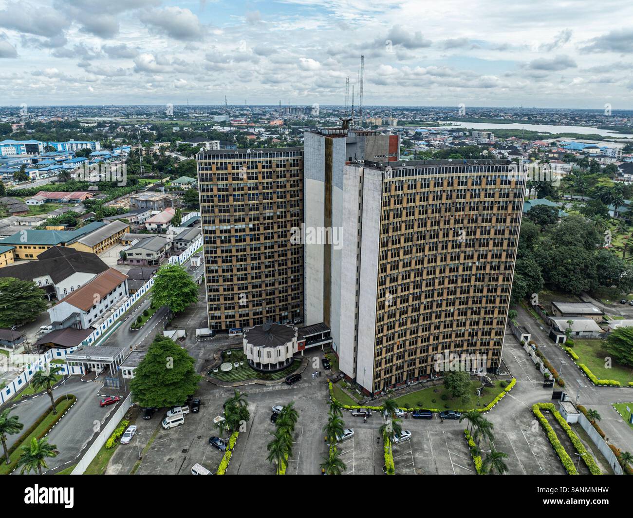 Aerial view of Podium block surrounded by modern buildings and greenery ...
