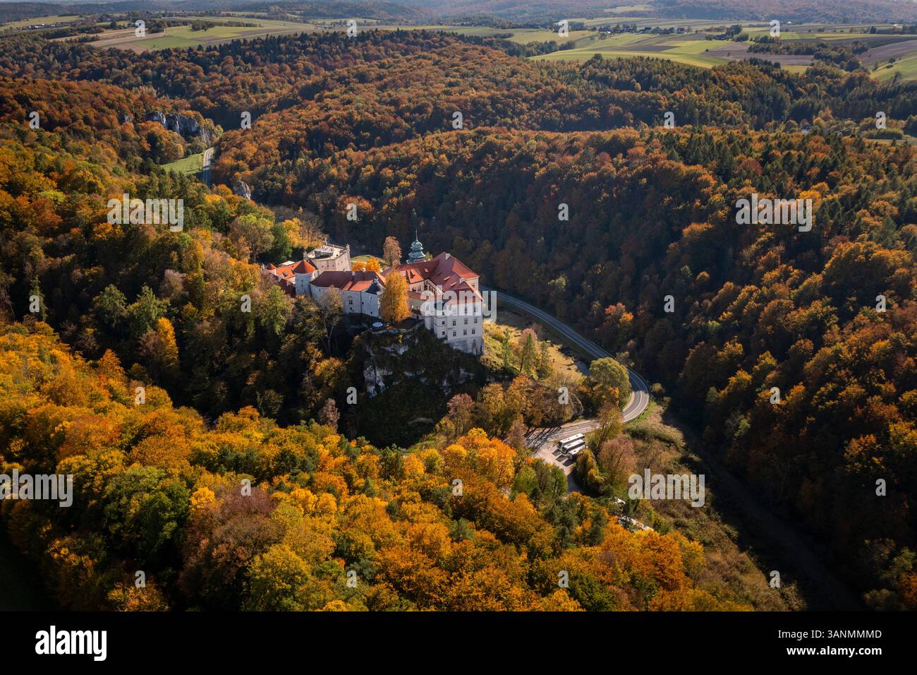 Aerial view of Pieskowa Skala castle surrounded by vibrant autumn ...