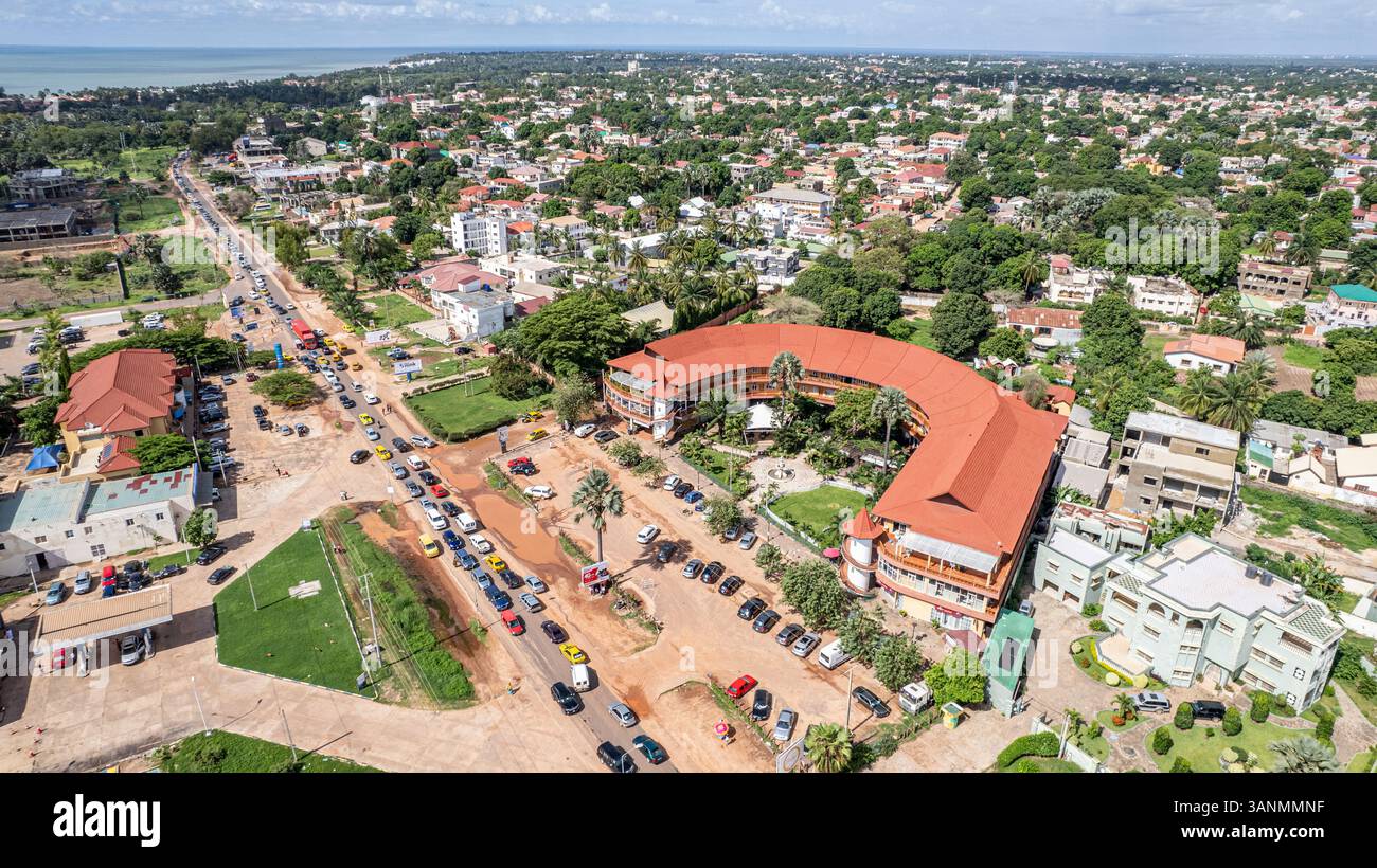 Aerial view of vibrant urban landscape with houses, cars, and roads ...