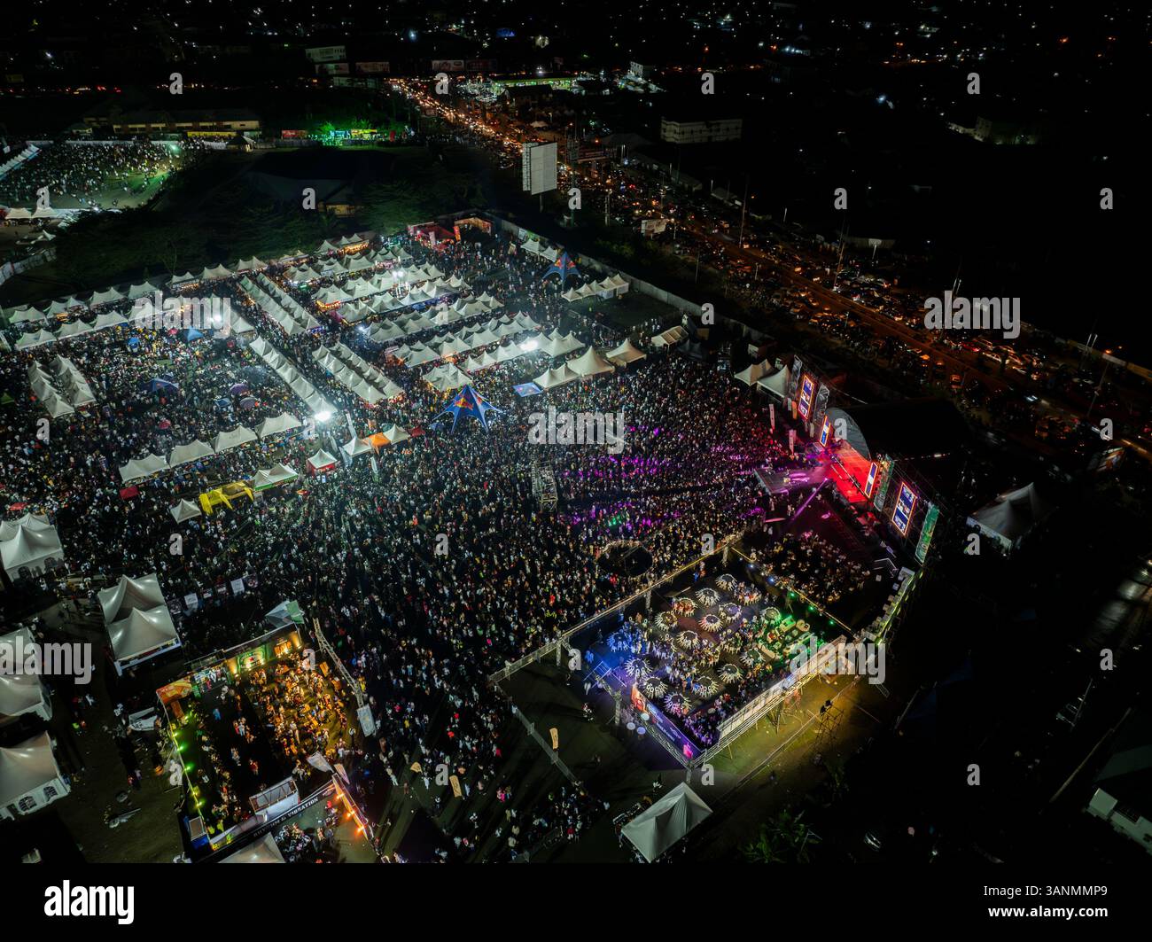 Aerial view of vibrant bole festival with crowded tents and dynamic ...