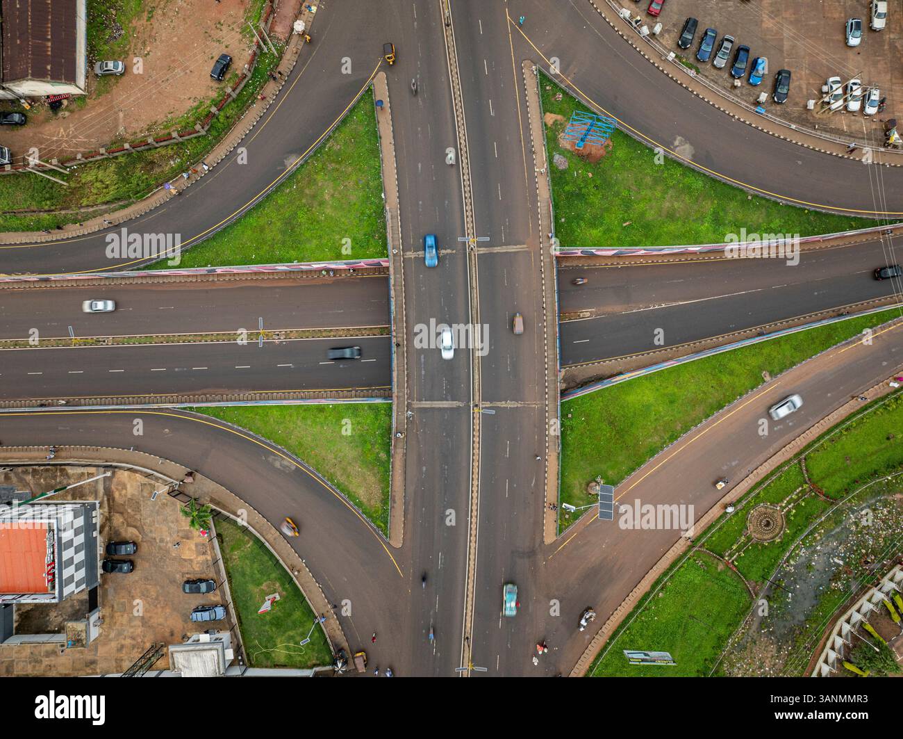 Aerial view of busy highway intersection with vehicles and modern ...