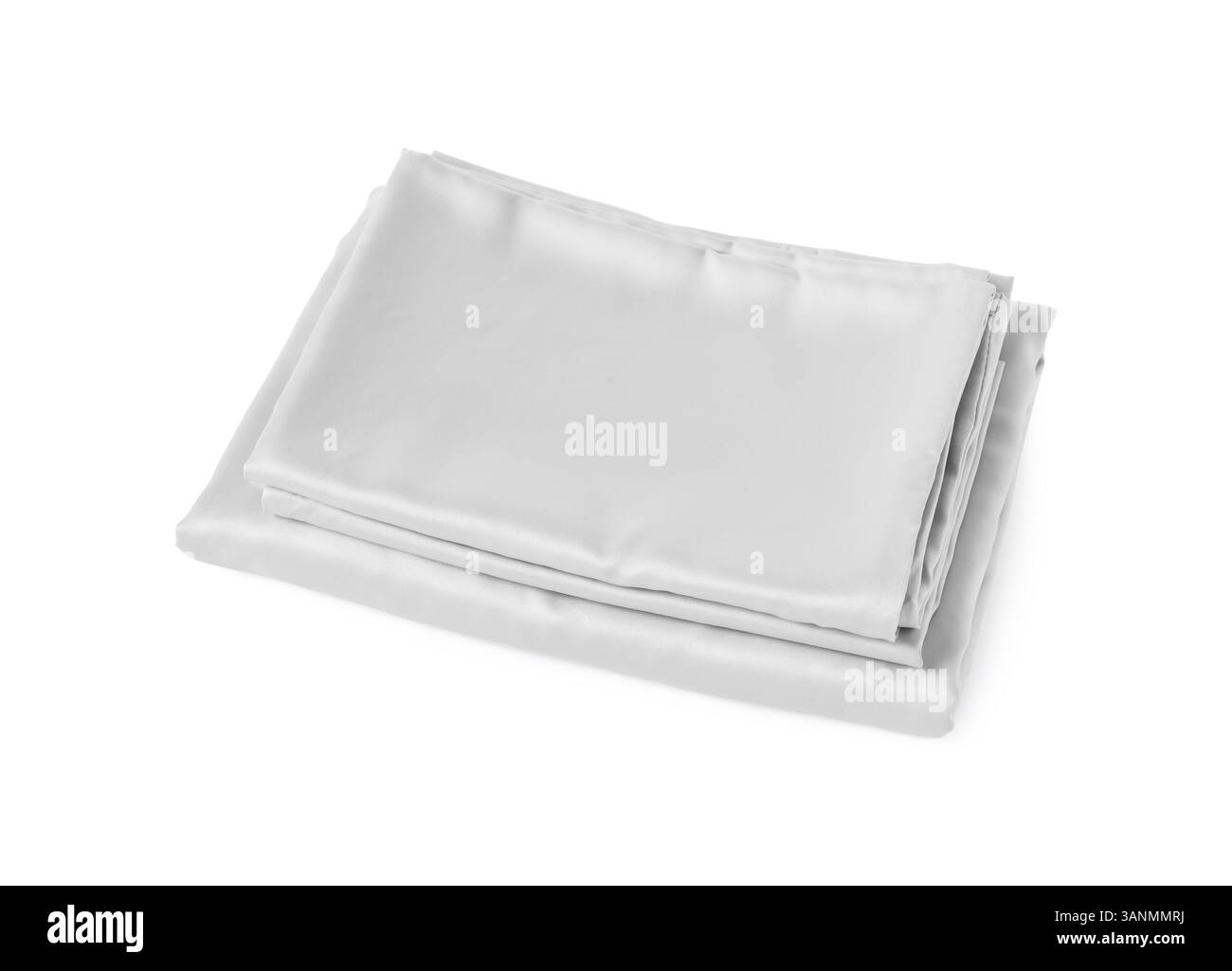 Stack of silky bed linens on white background Stock Photo - Alamy