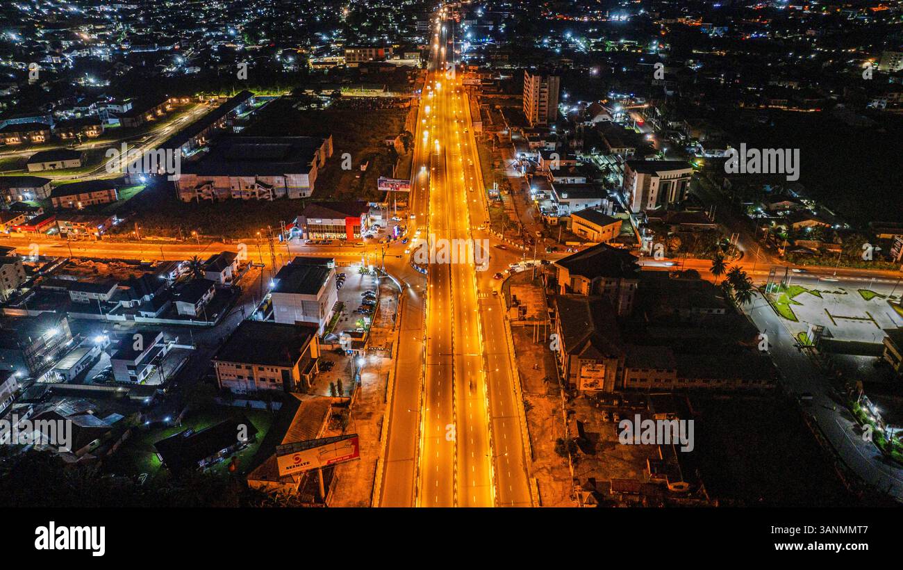 Aerial view of beautiful cityscape with night lights and busy roads ...