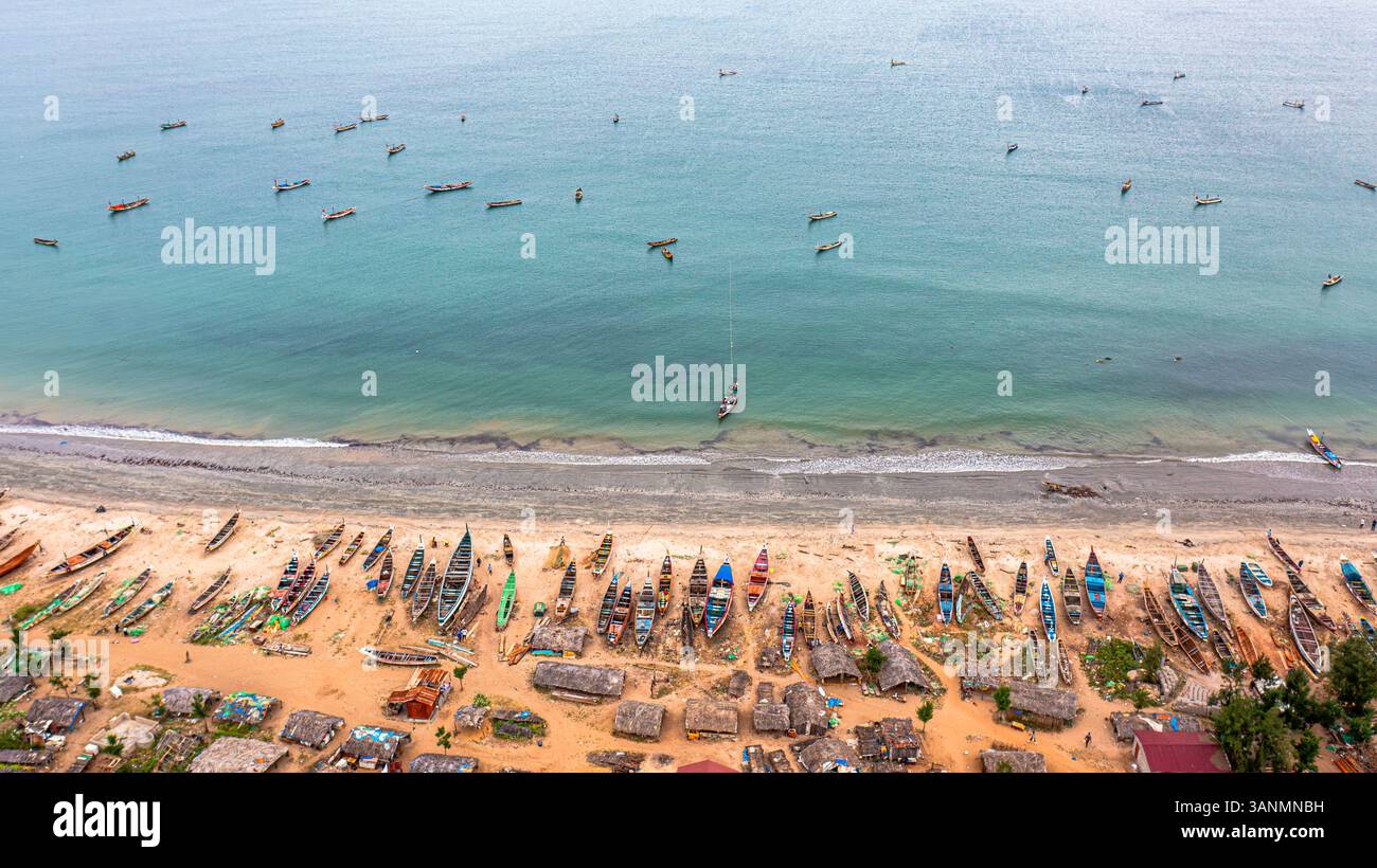Aerial view of brufut fish market with fishing boats and sandy beach ...