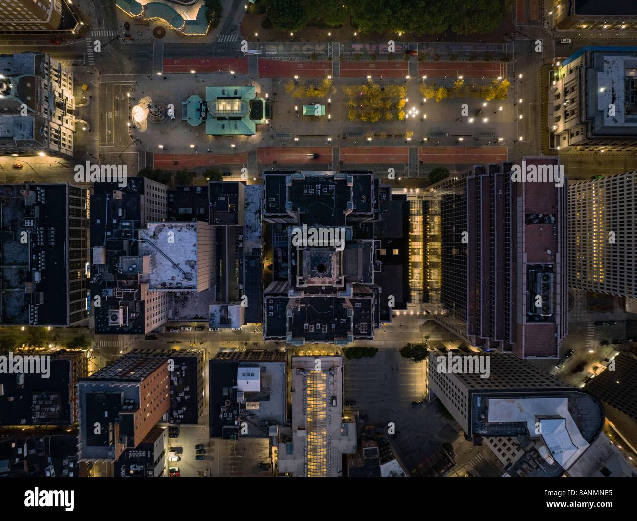 Aerial view of illuminated city lights and skyscrapers in downtown ...