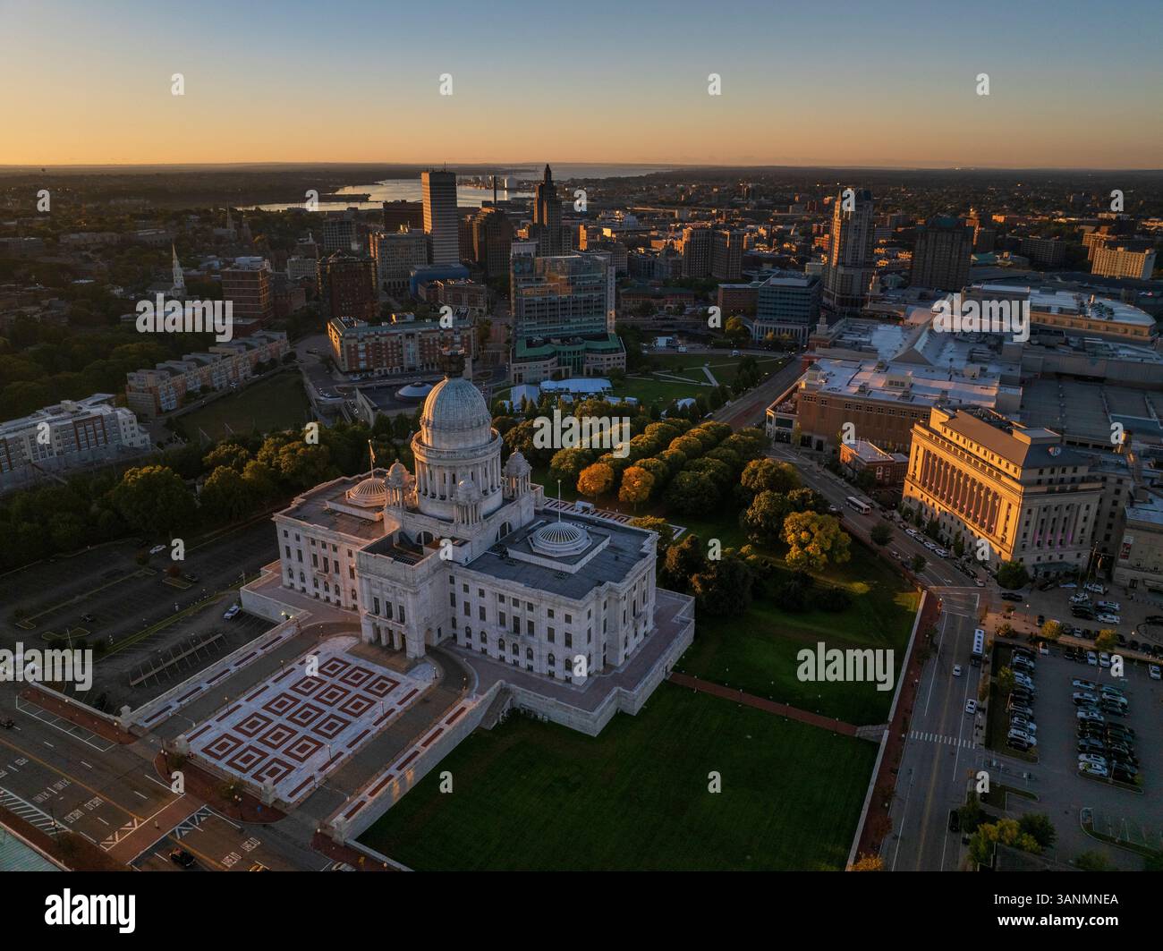 Aerial view of beautiful skyline at sunrise with city lights and ...