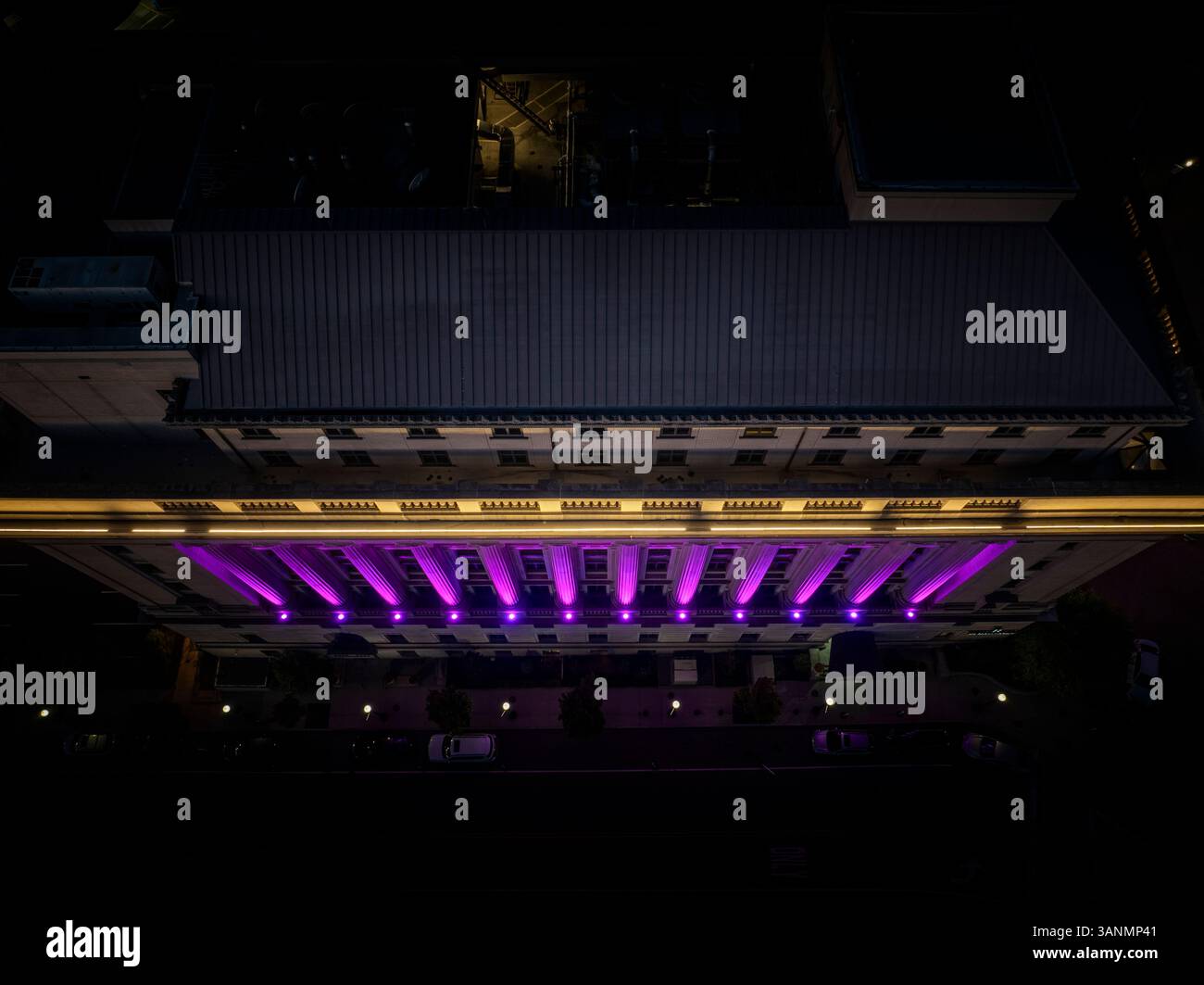 Aerial view of vibrant city lights and modern architecture at night ...