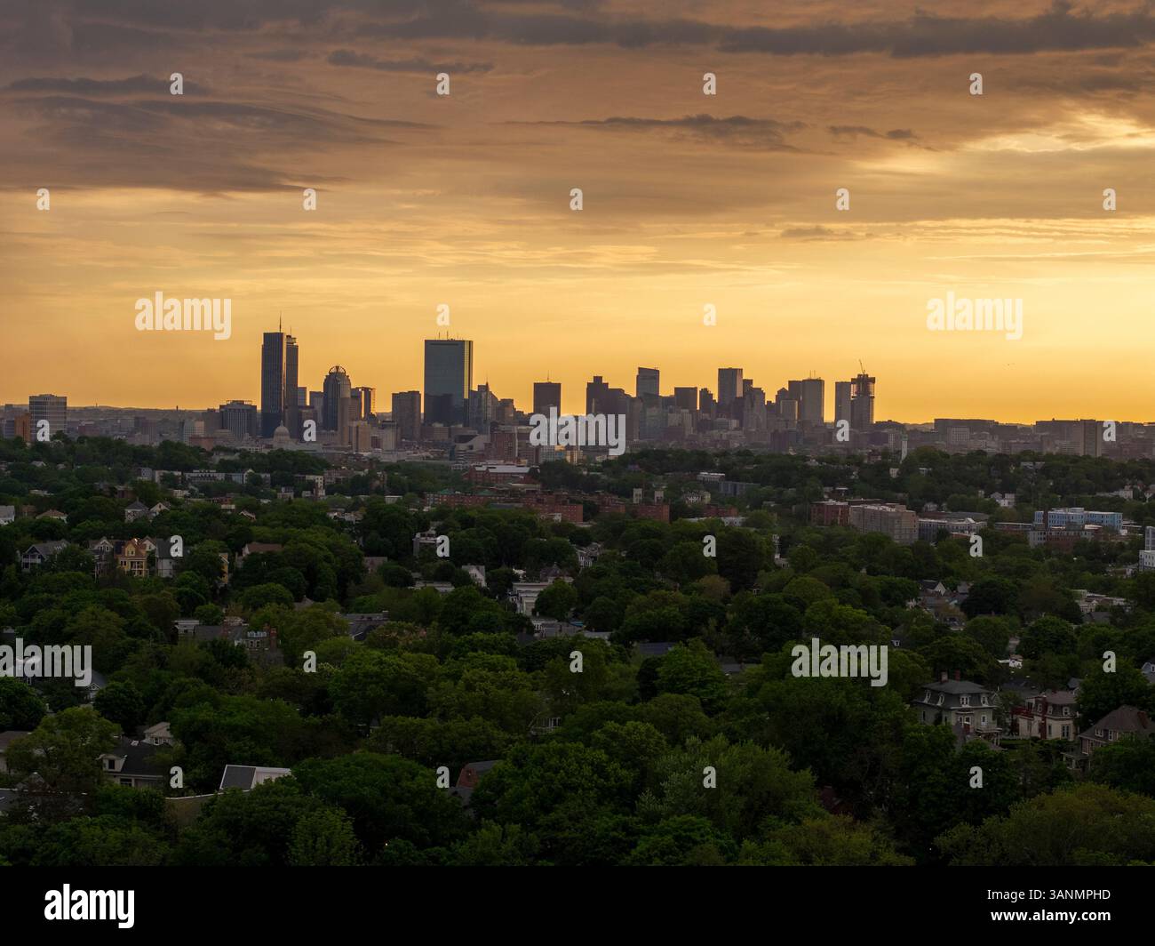 Aerial view of boston skyline at sunset with beautiful clouds and lush ...