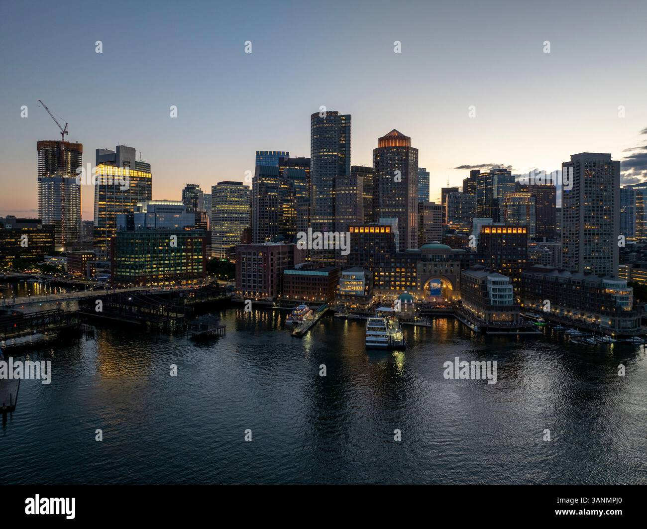 Aerial view of the beautiful Boston skyline with boats and docks at ...