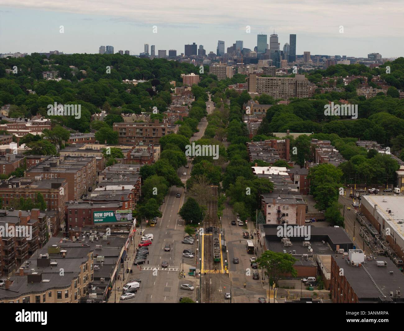 Aerial view of busy cityscape with highrise buildings and tree-lined ...