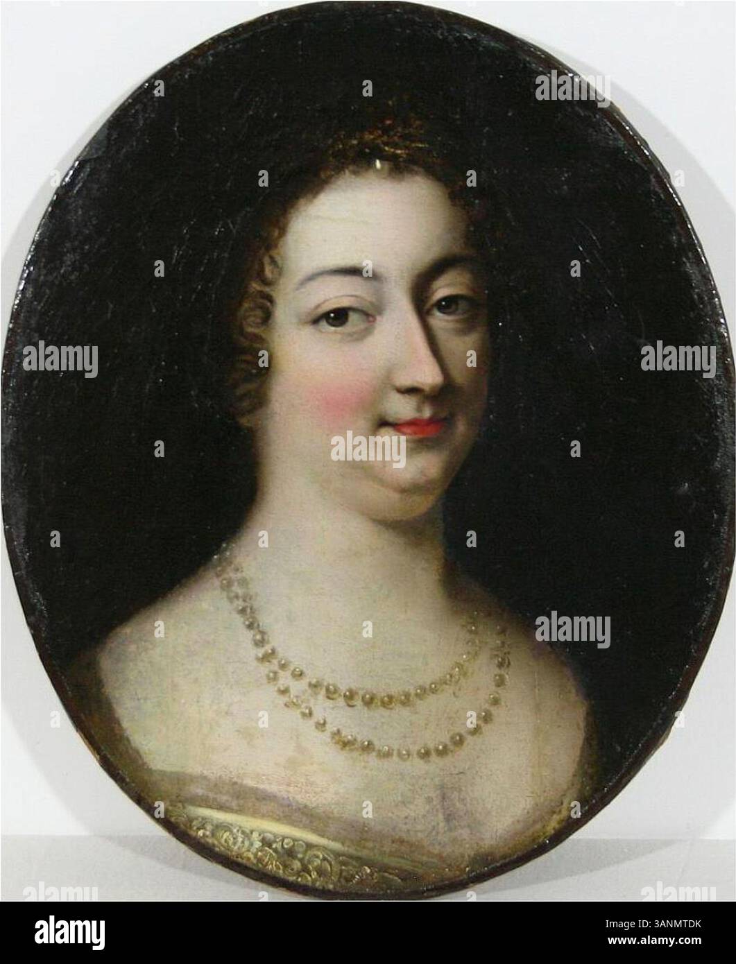 A 17th-century French portrait of a lady in an oval frame, depicting ...